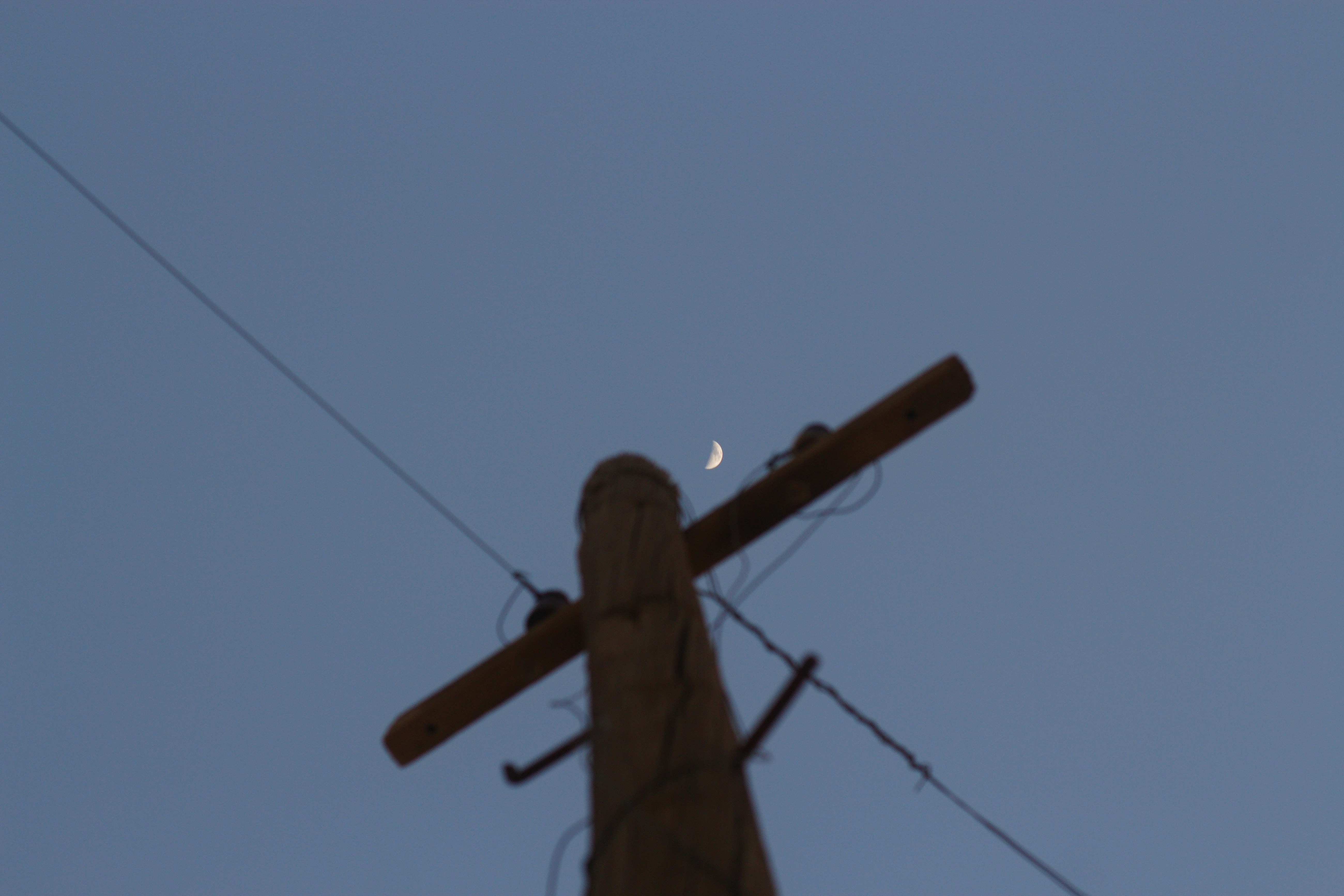 Moon-Topped Mast Under a Quiet Evening Sky