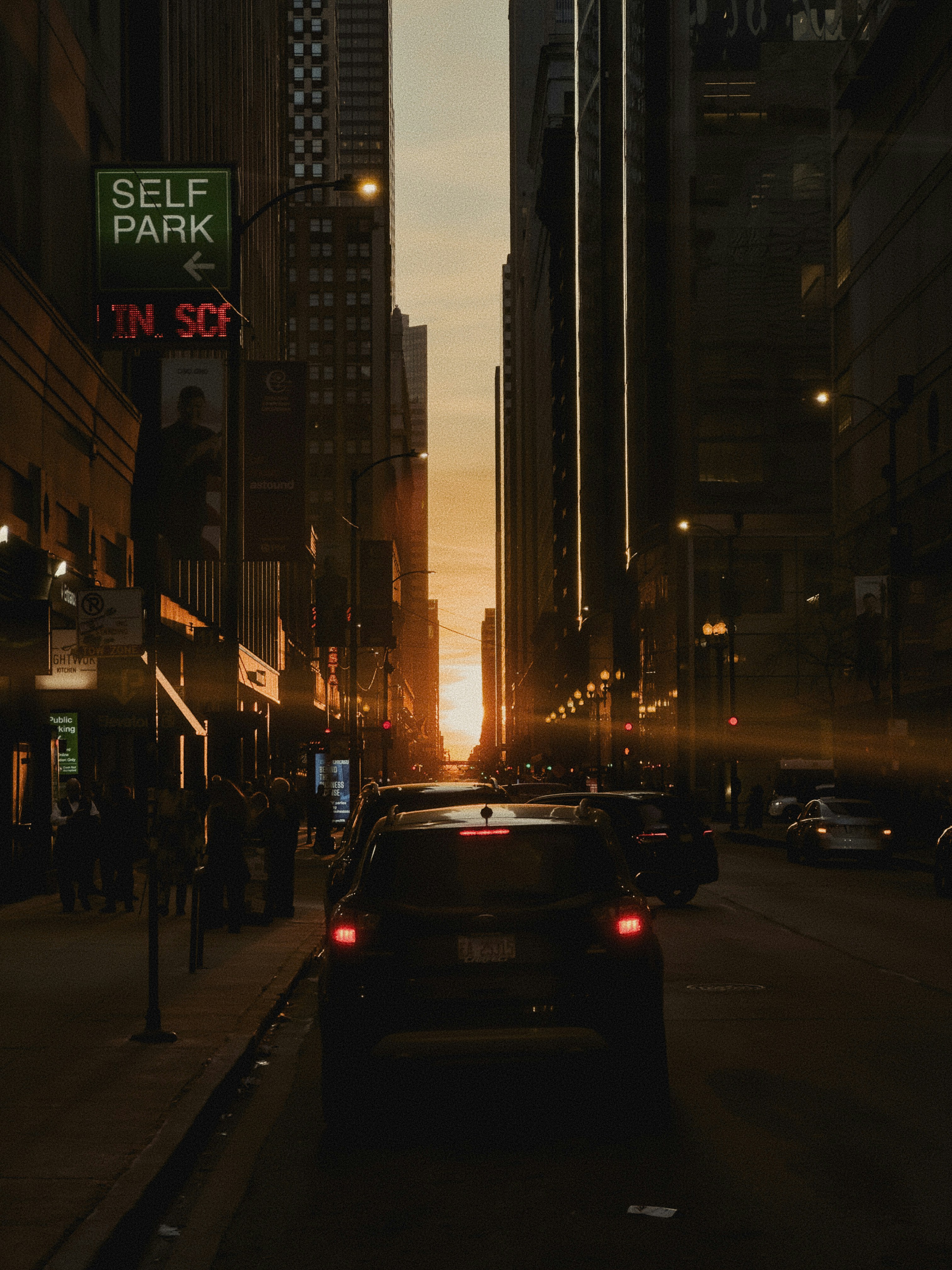 Golden Hour Traffic: Sunset Between Skyscrapers