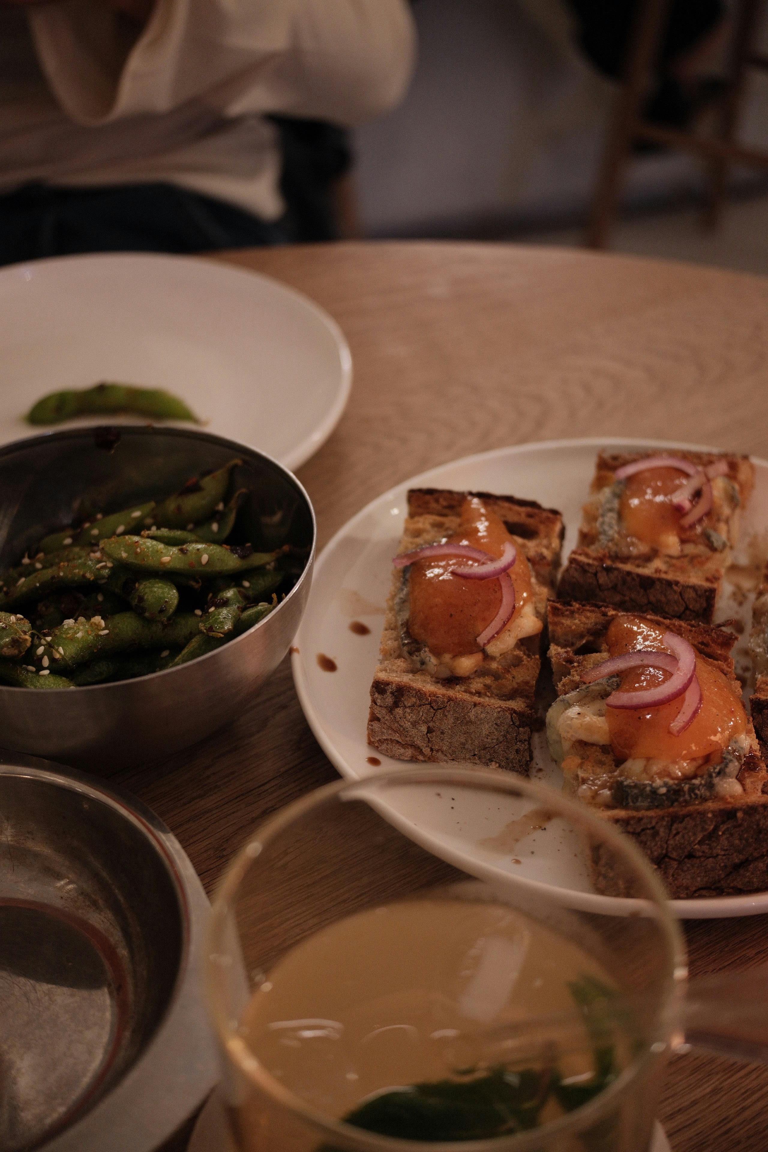 Savory Crostini Mosaic: Pastry and Beans on a Rustic Table