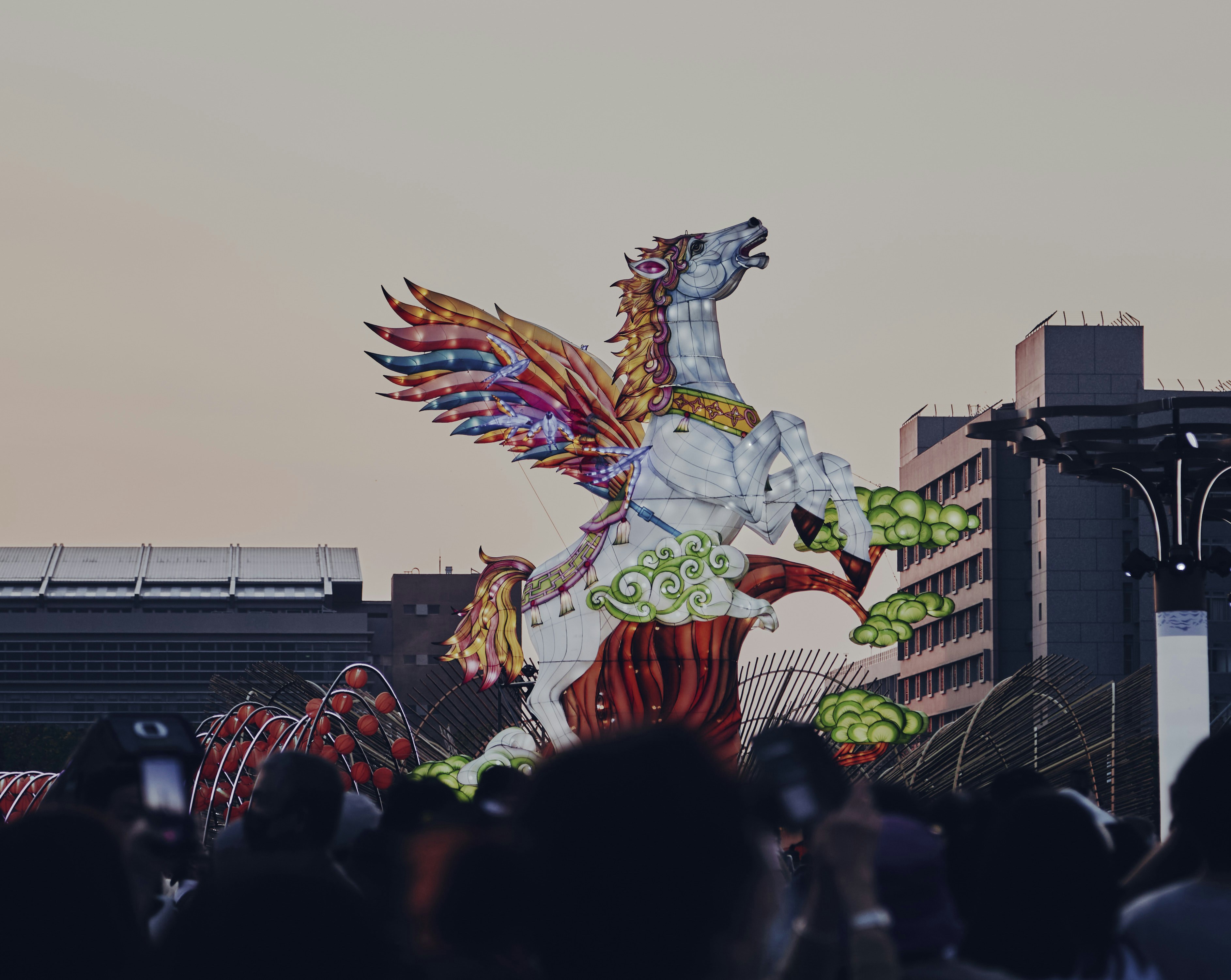 Illuminated Dragon Steed Rises Above a Darkened Crowd