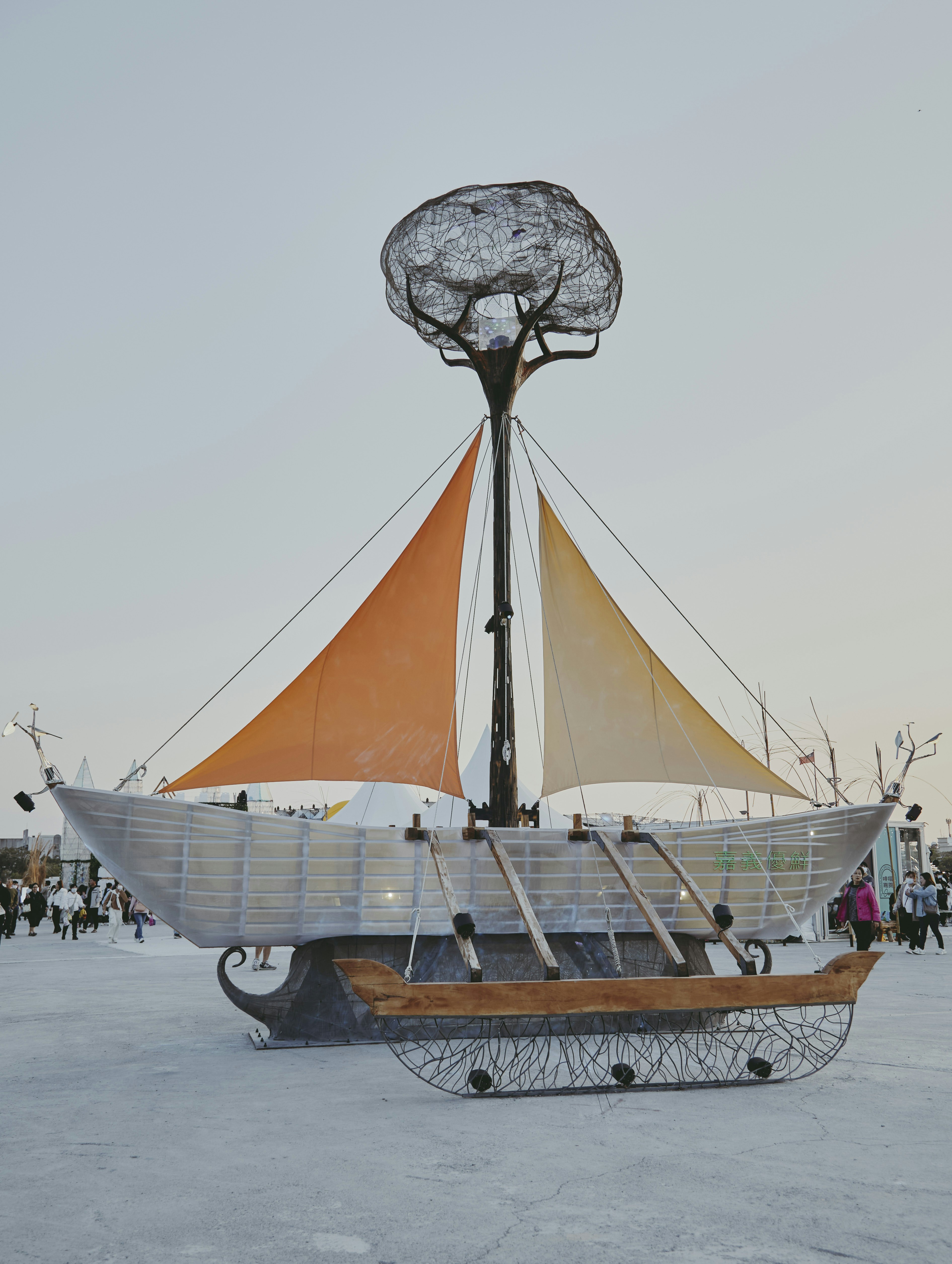 Sailing Ship Sculpture on Ice: A Tented Mast Under a Clear Sky