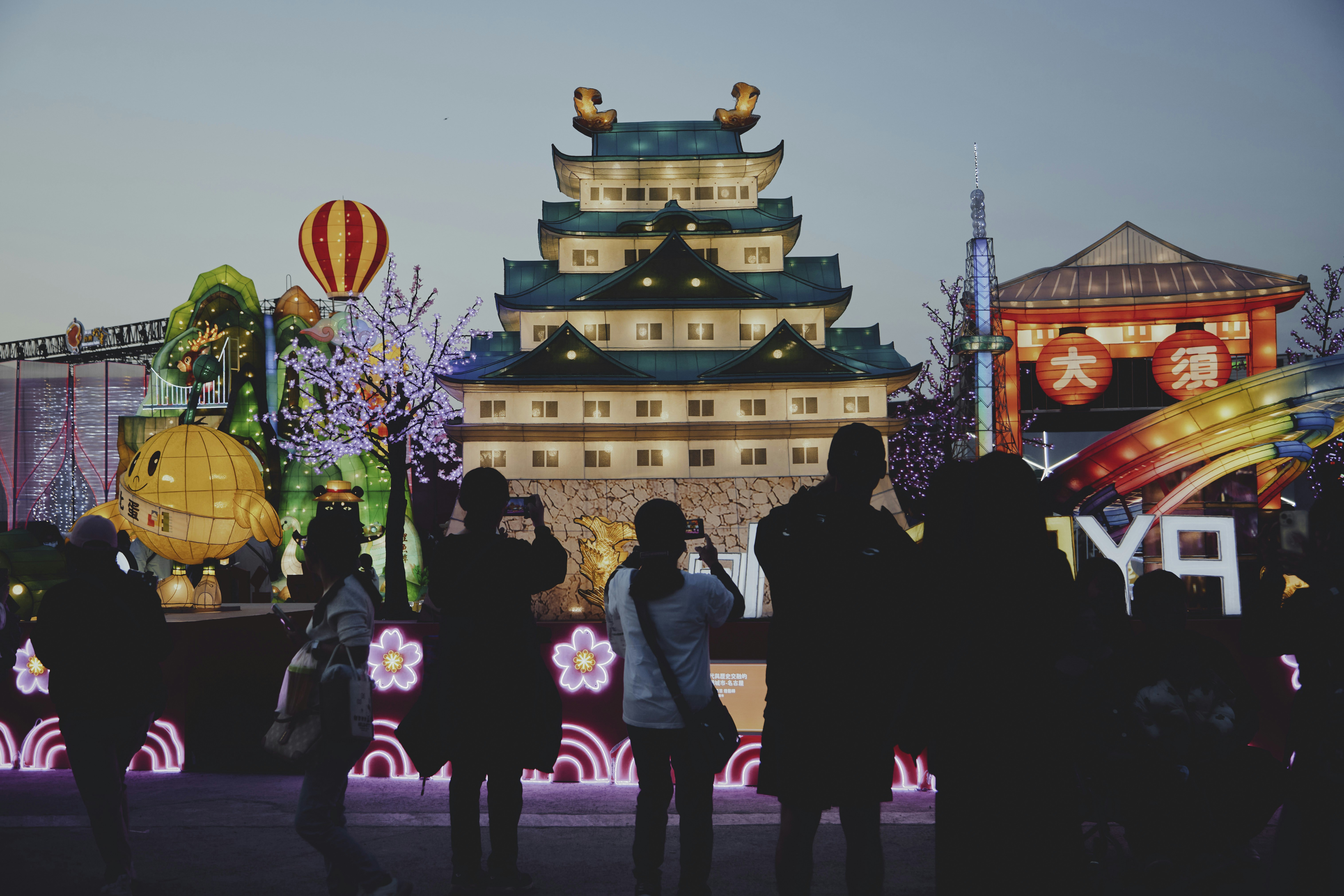 Neon Lanterns and a Castle Facade: Night Life at the Festival Grounds