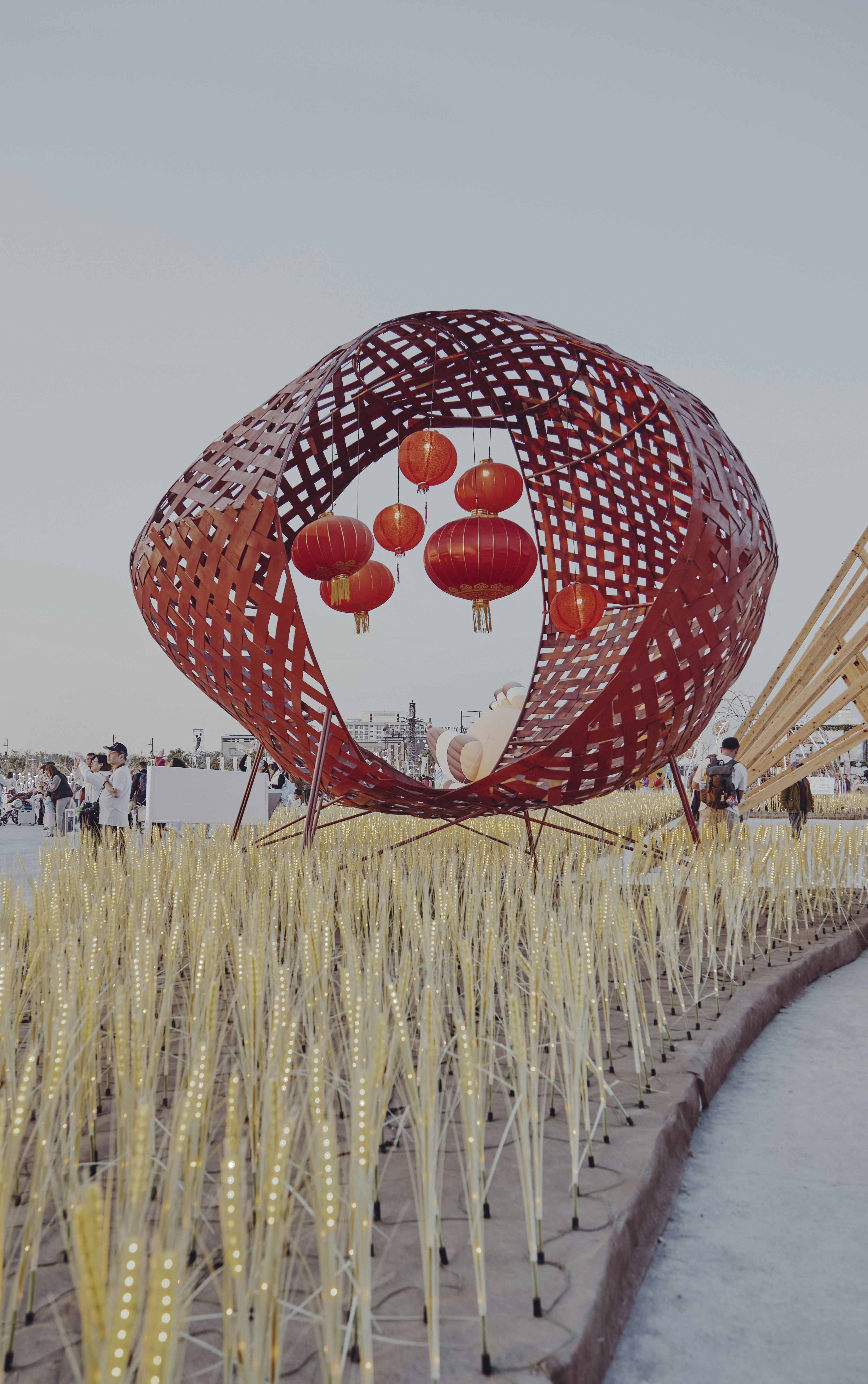 Red Orb: Lantern Sphere Framing a Patchwork Sky