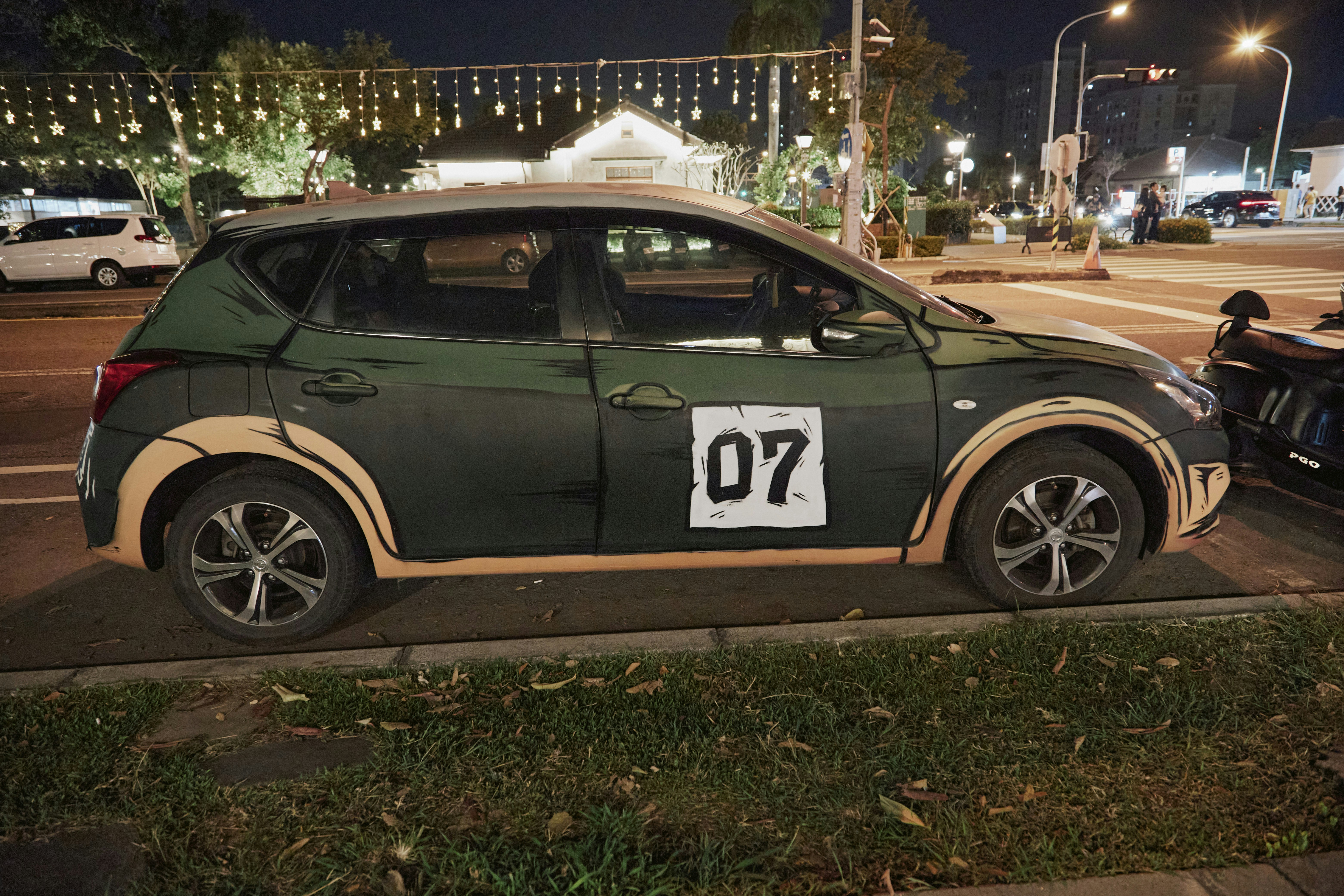 Patched-Up Racer: A Night Rally Car Stalled in Neon Streetlight Glow