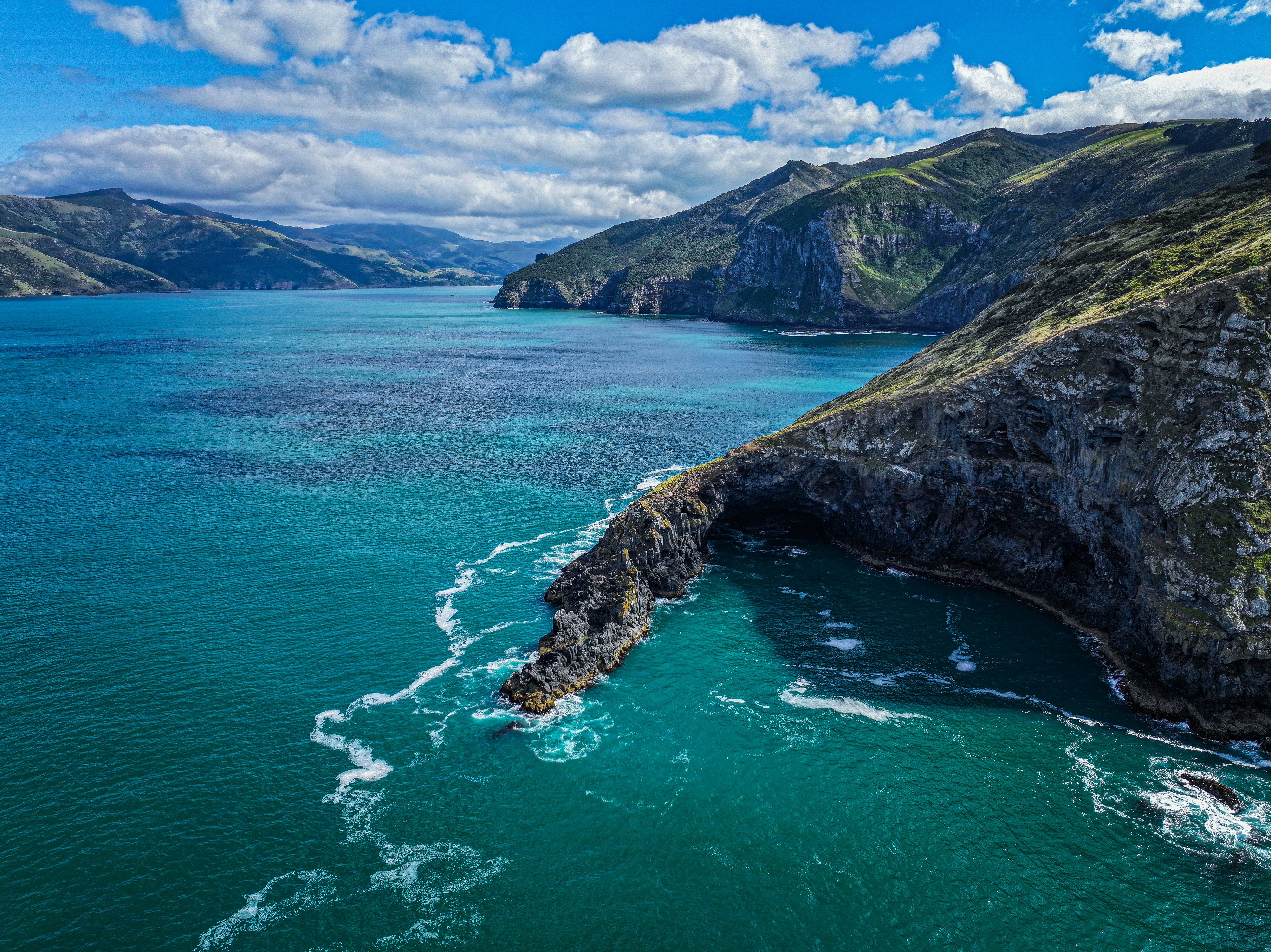 Blue Covenant: A Cliffside Cleft Embracing the Sea