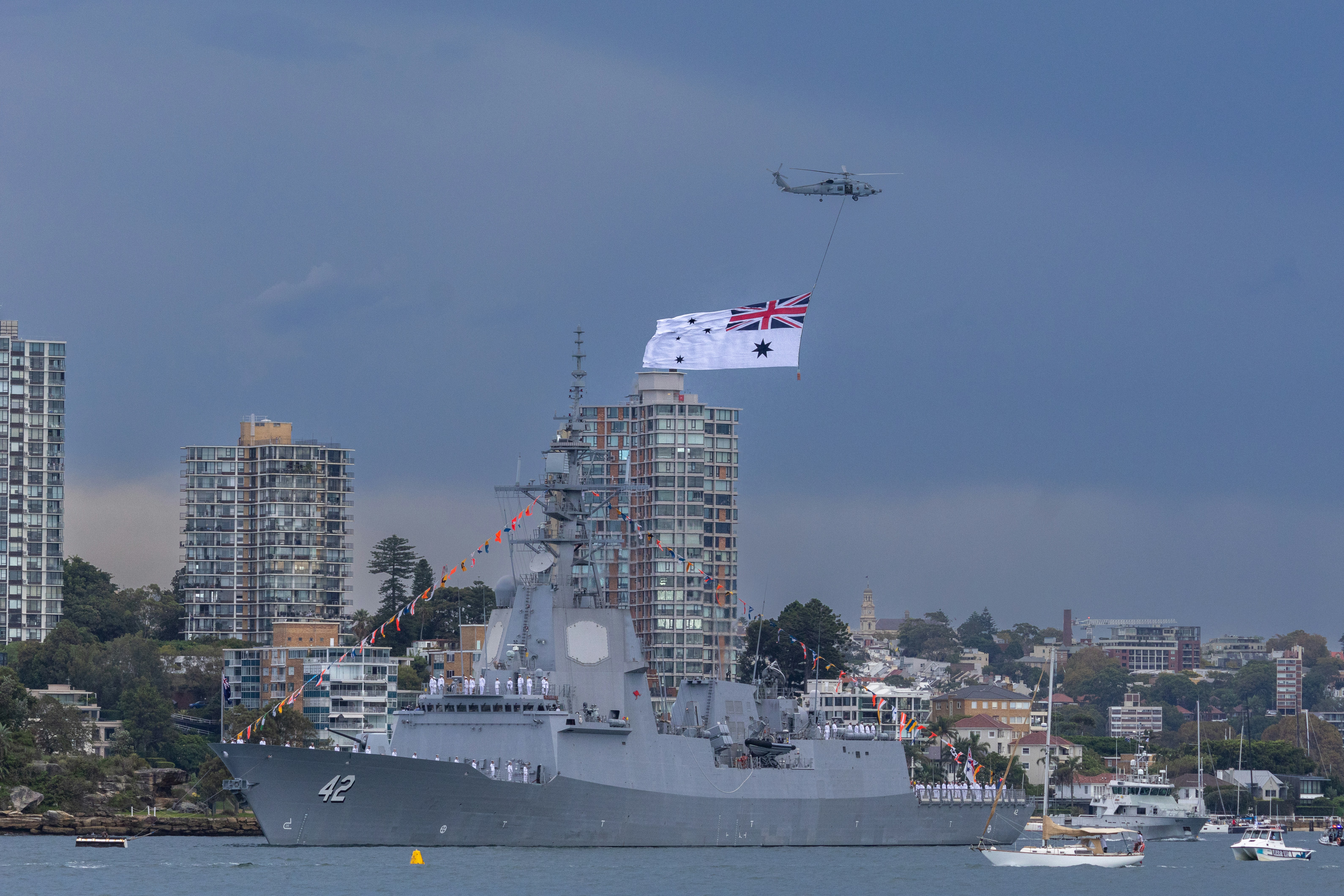 Landing Deck Quiet: A Sydney-class Destroyer Stands Sentinel Over the Harbor