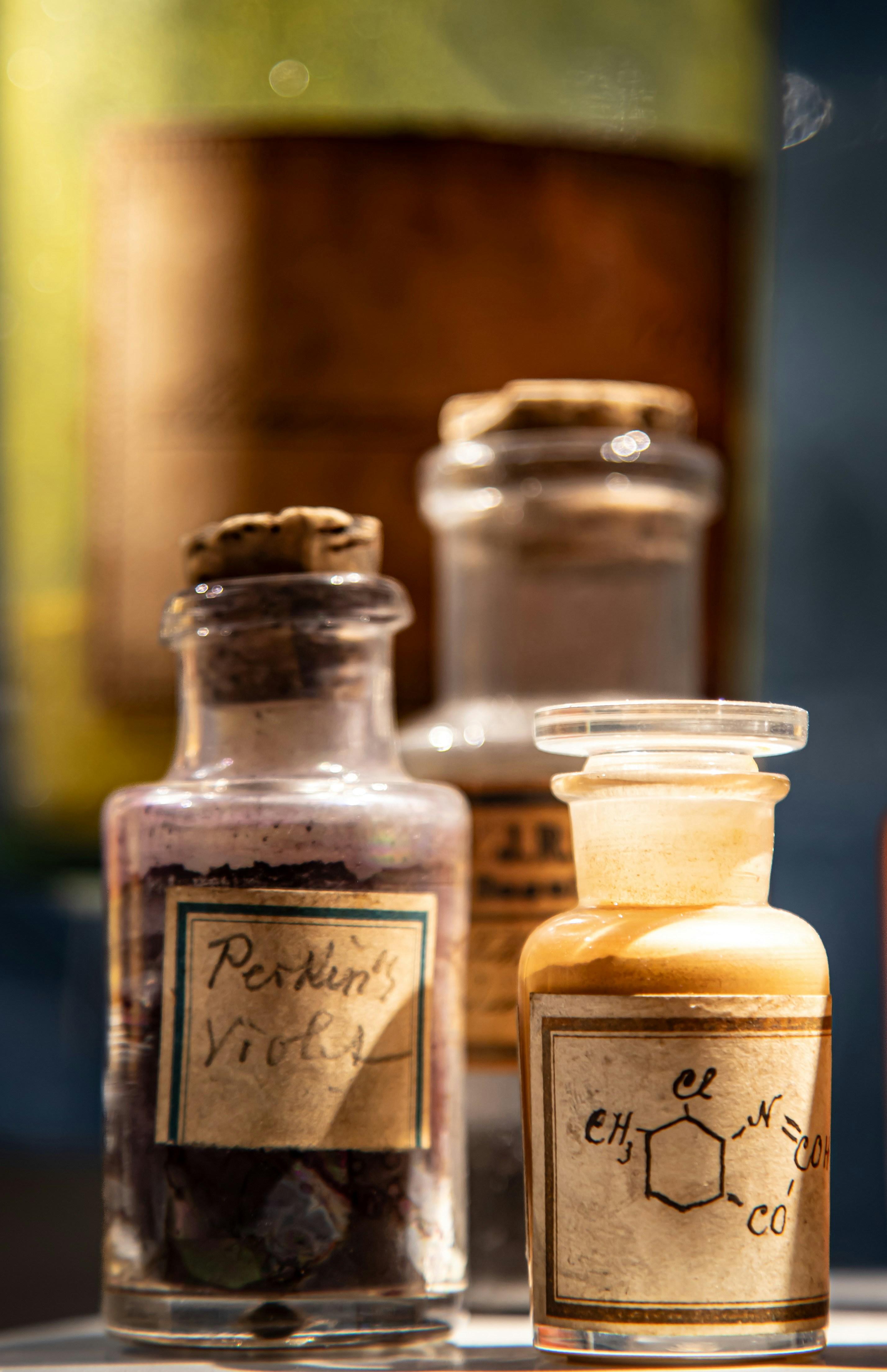 Miniature Apothecary: A trio of vintage bottle jars in faded focus