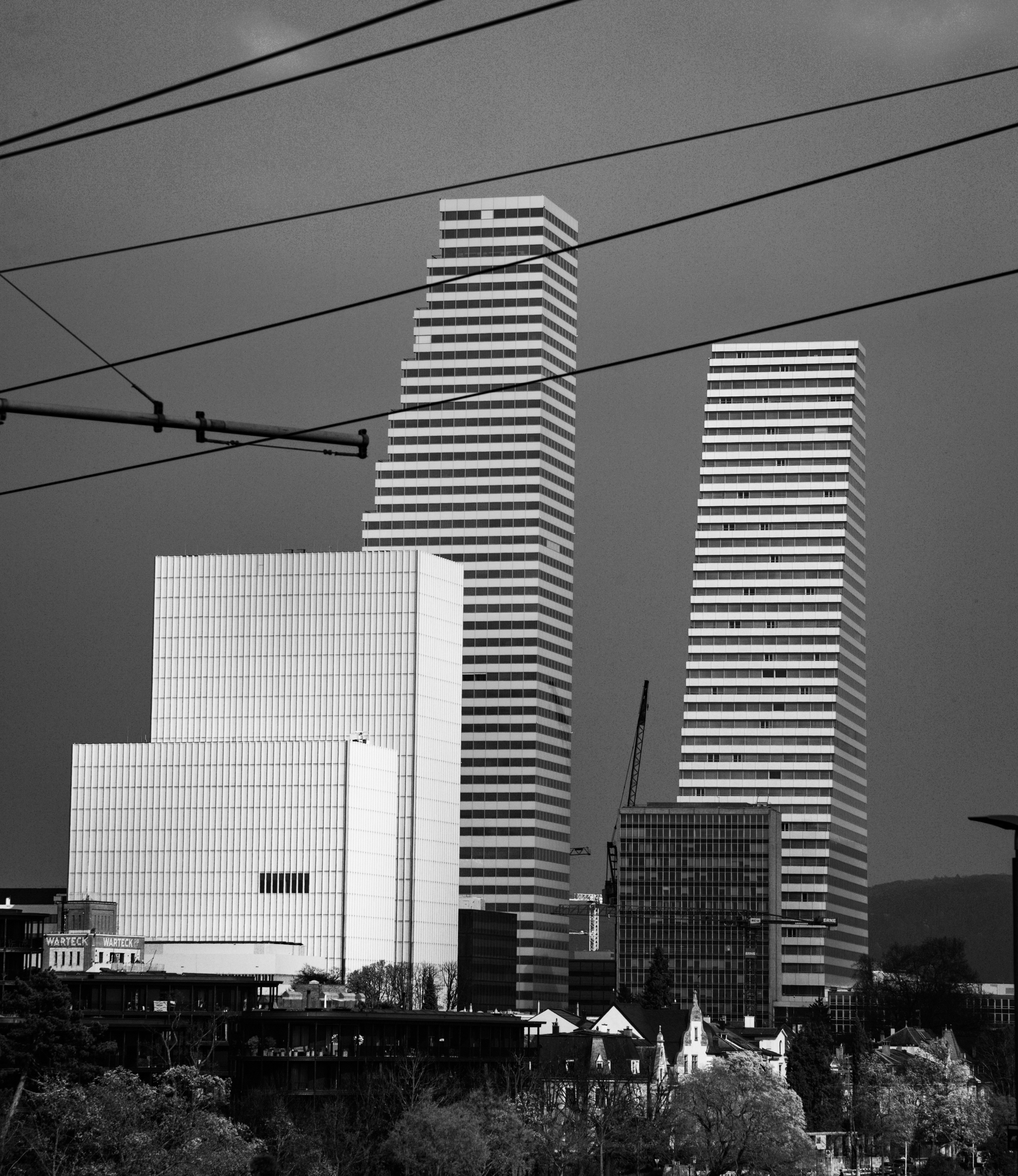 Monochrome Skyline: Twin Towers Rise Over a Modern Fabric