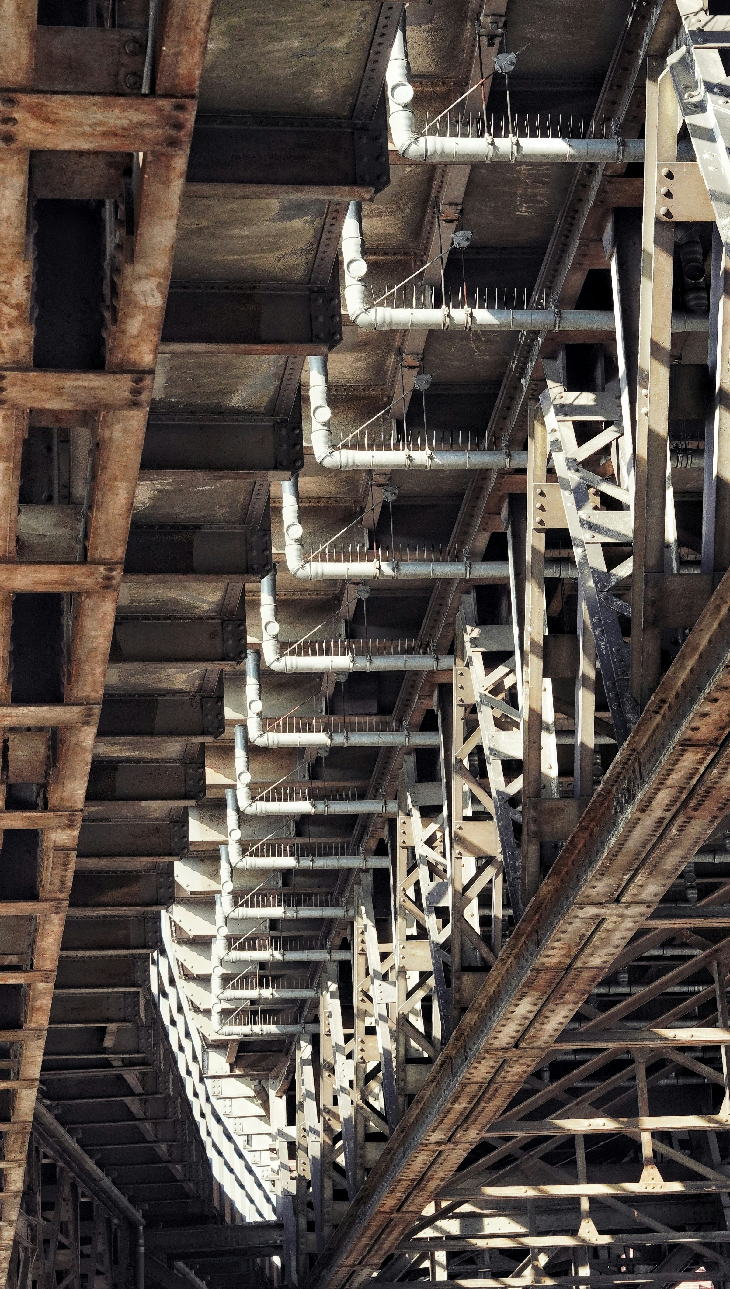 Underbelly of Steel: Repeating Ribs of an Industrial Rig