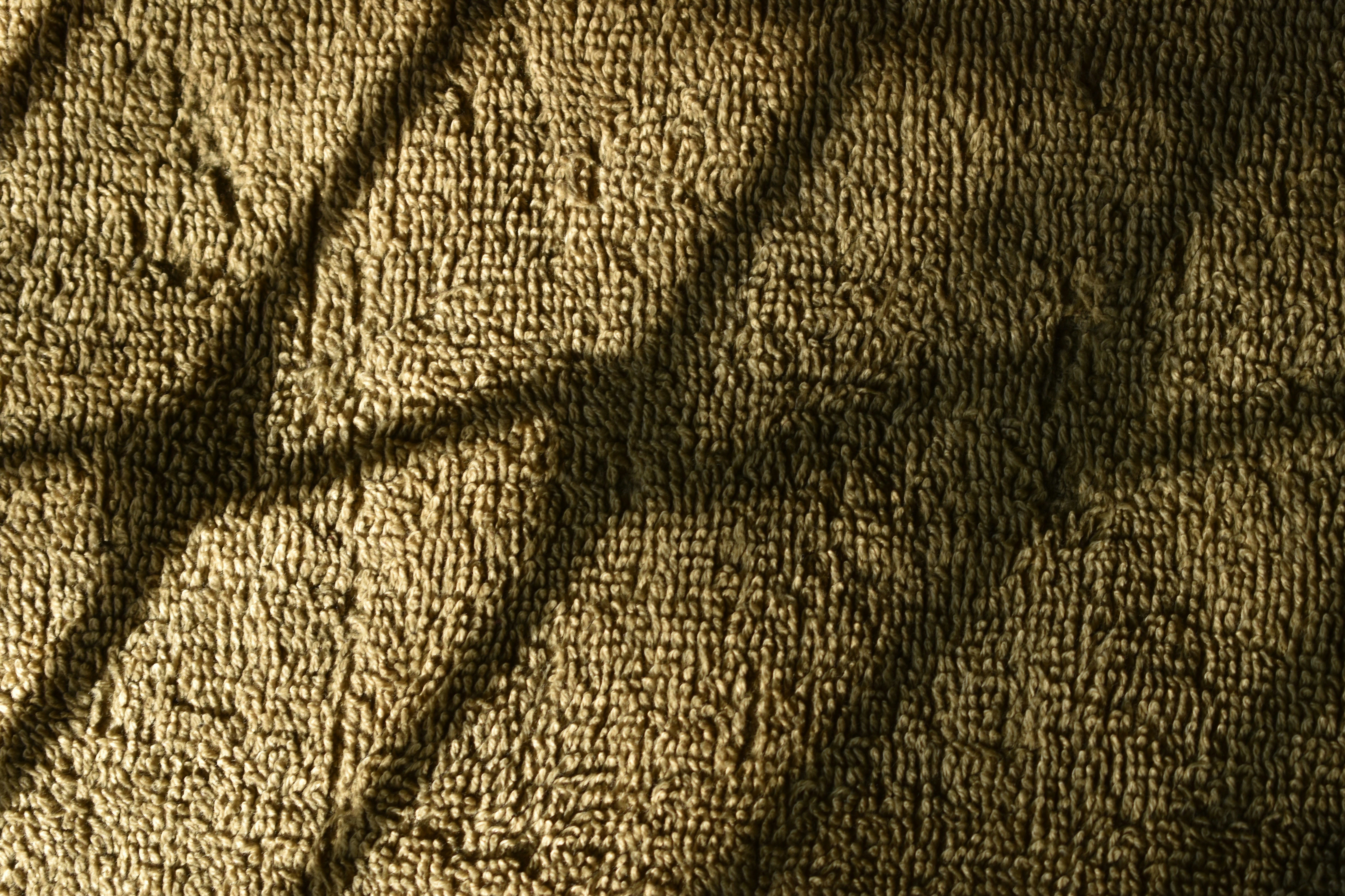 Cracked Asphalt Shadows: A Close-Up of Textured Terrain and Framing Lines