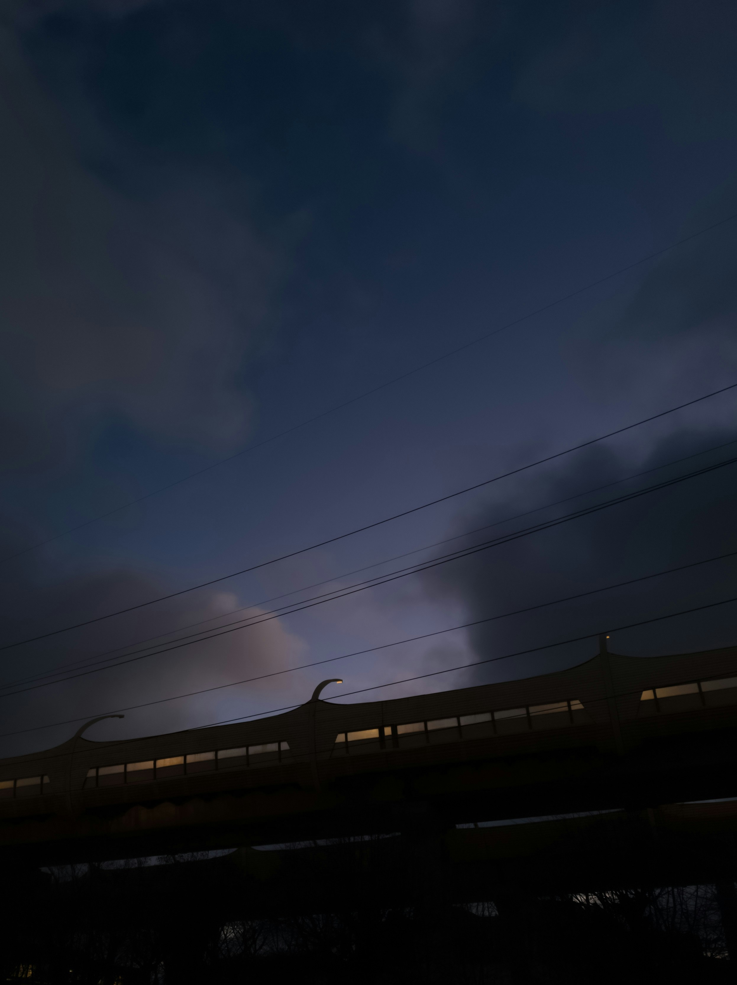 Under the Quiet Overpass: Twilight Railings and Sky