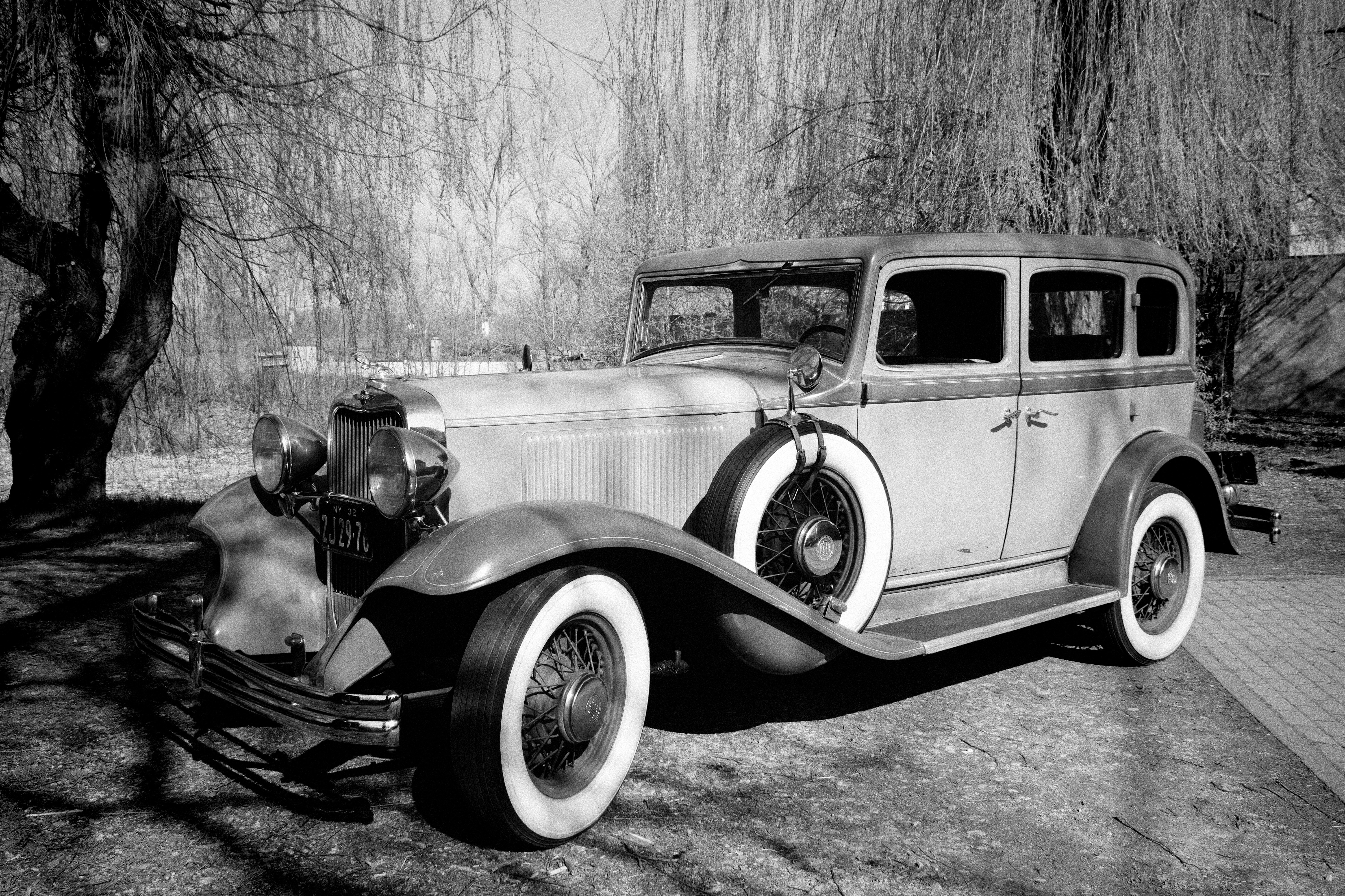 Vintage Streamlined: A Classic Automobile Resting in Shaded Light