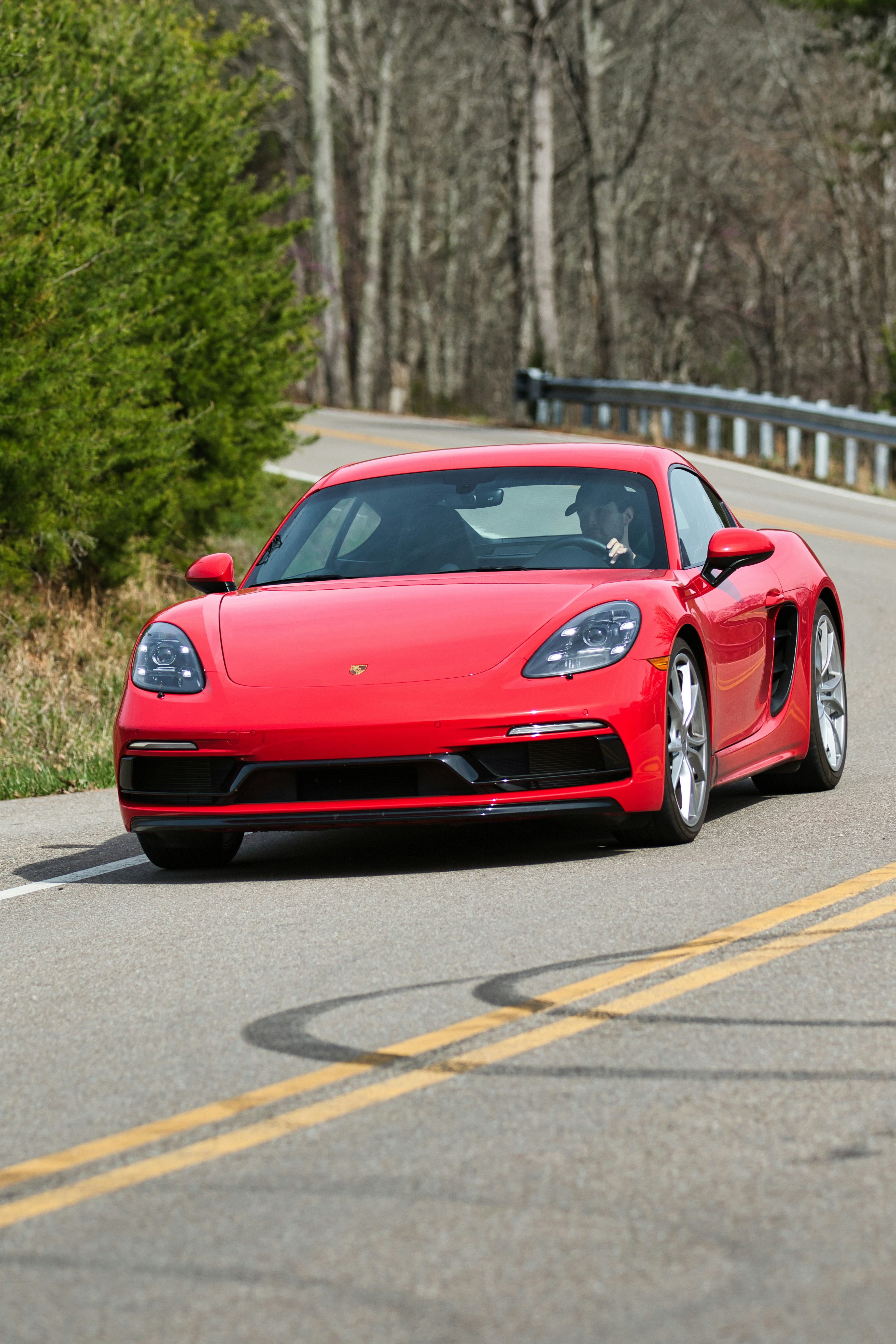 Red Porsche Surges Along a Quiet Road