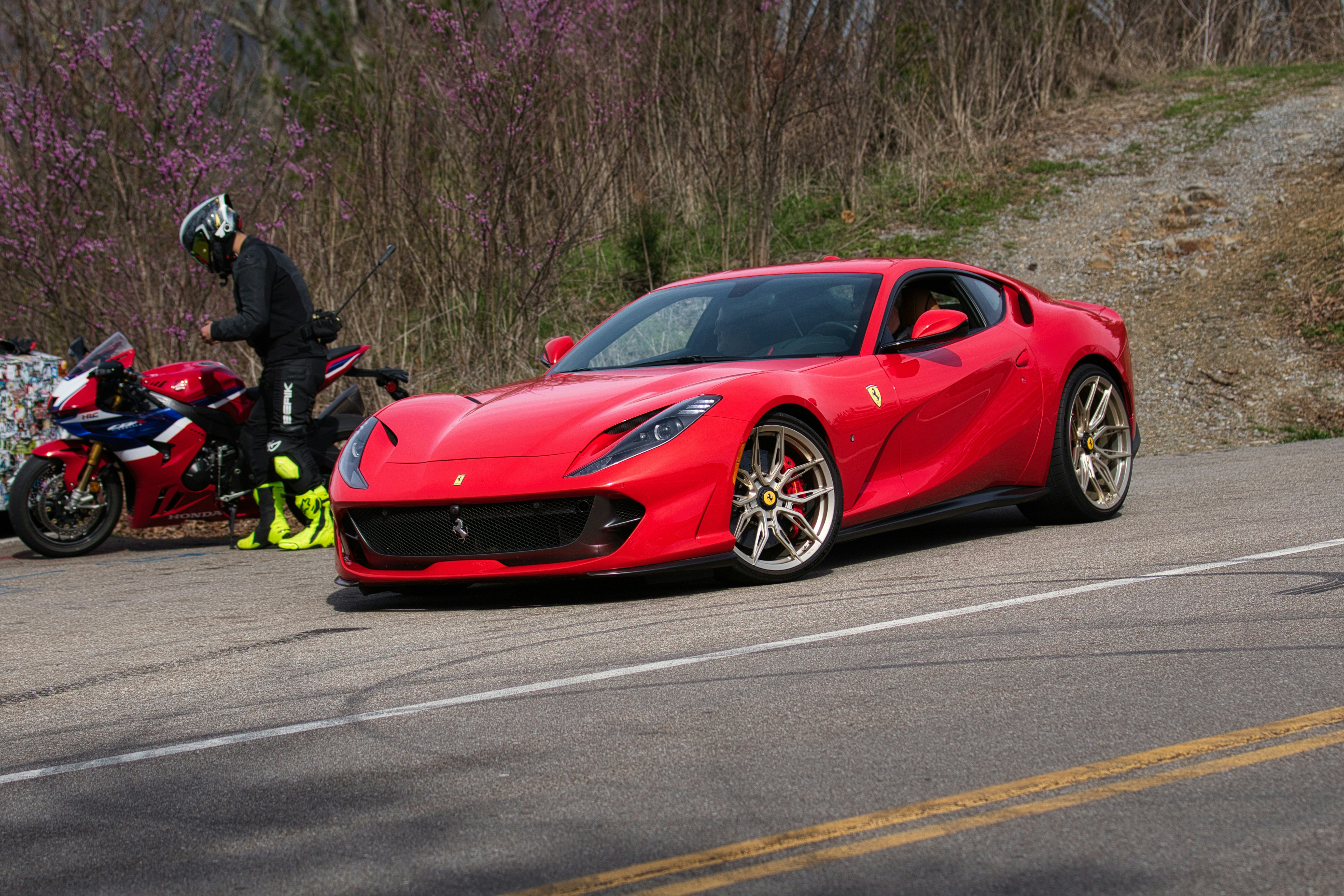 Red Ferrari Stopping on a Mountain Road