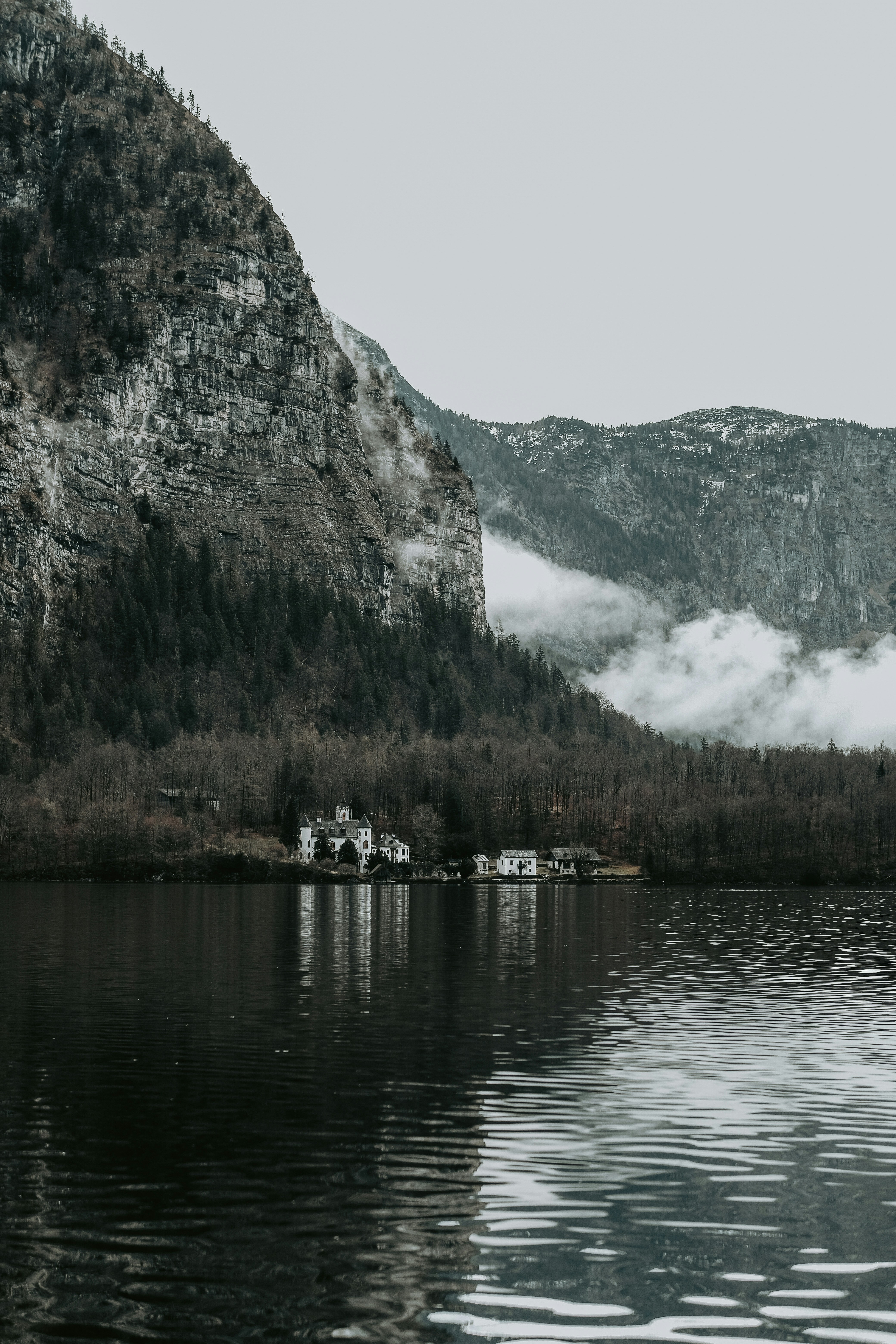 Gigantic Cliff, Quiet Lake: A Monochrome Mountain Retreat