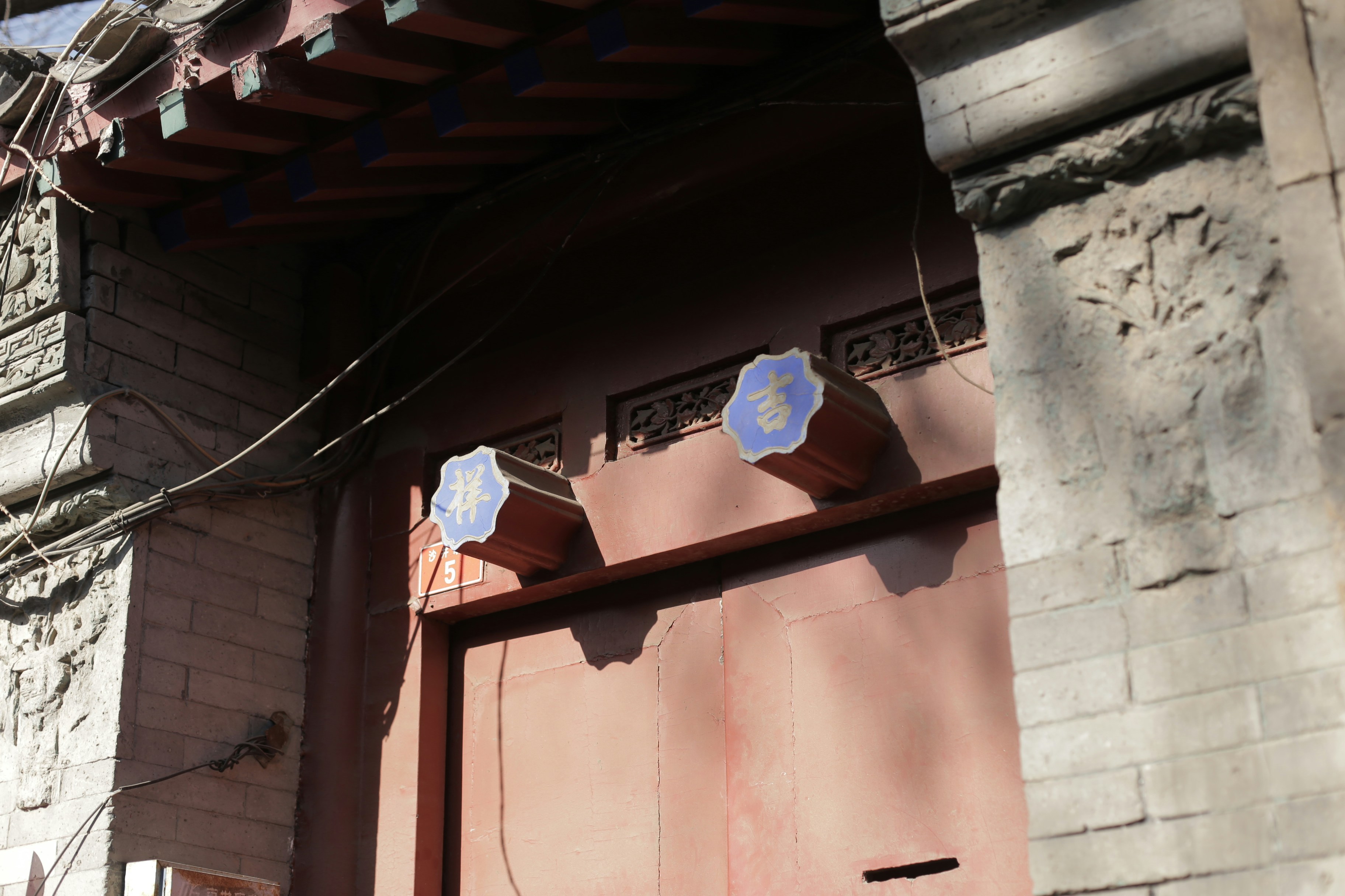 Temple Gate with Hanging Lanterns: Weathered Red Door