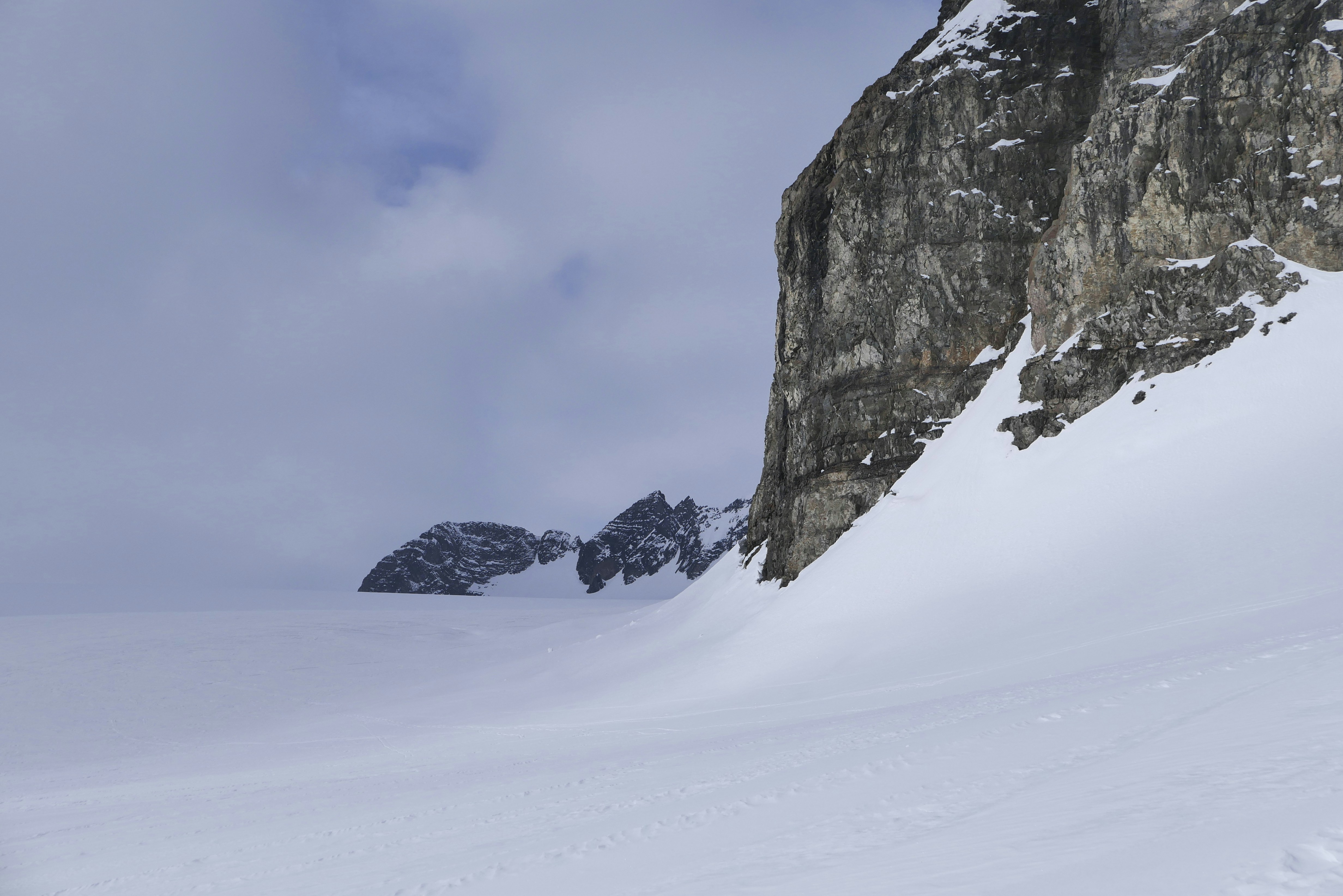 Snowbound Cliff Edge Under a Quiet Sky