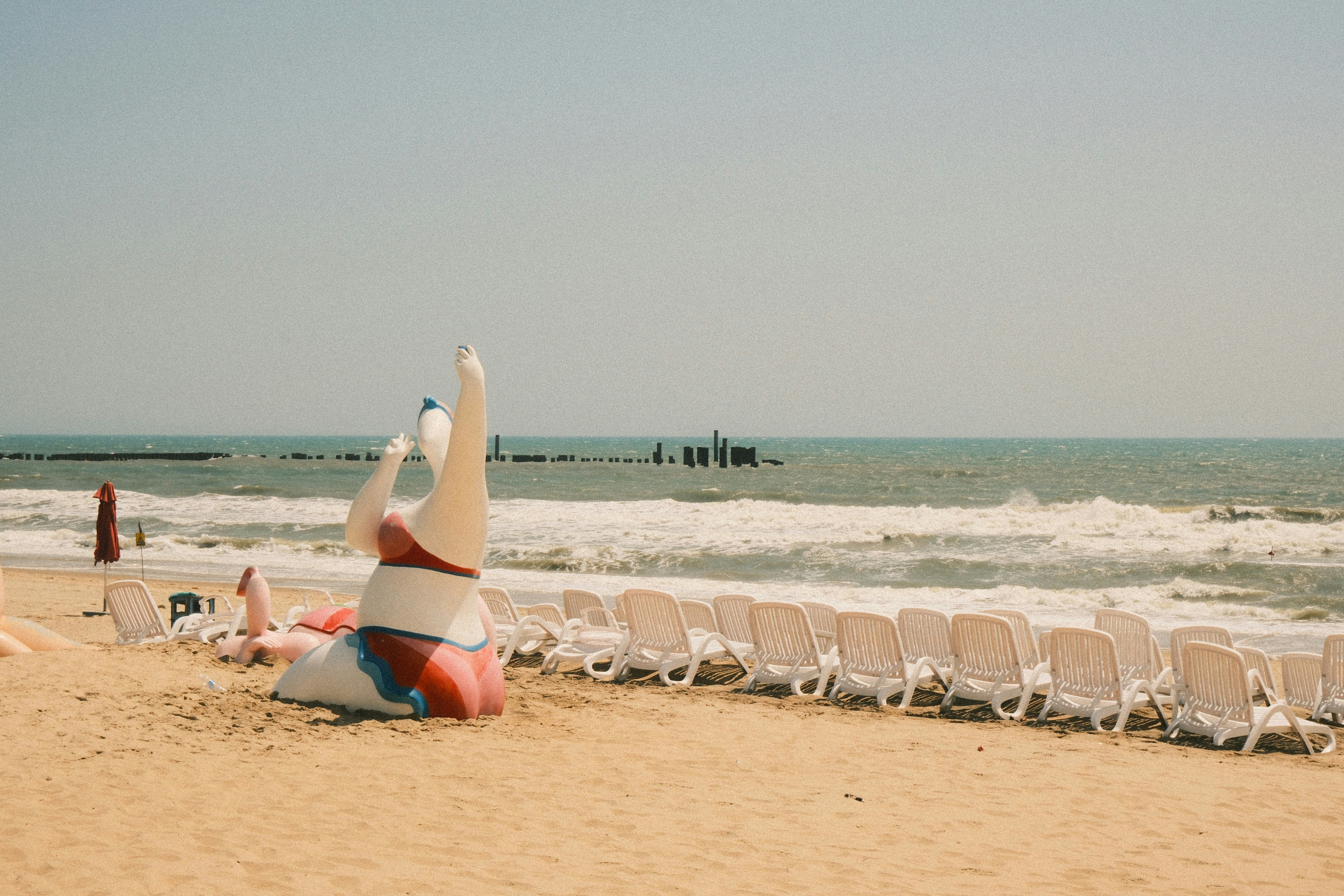 Sun-soaked Beach Silhouette: A Lifeguard of Sand and Sea