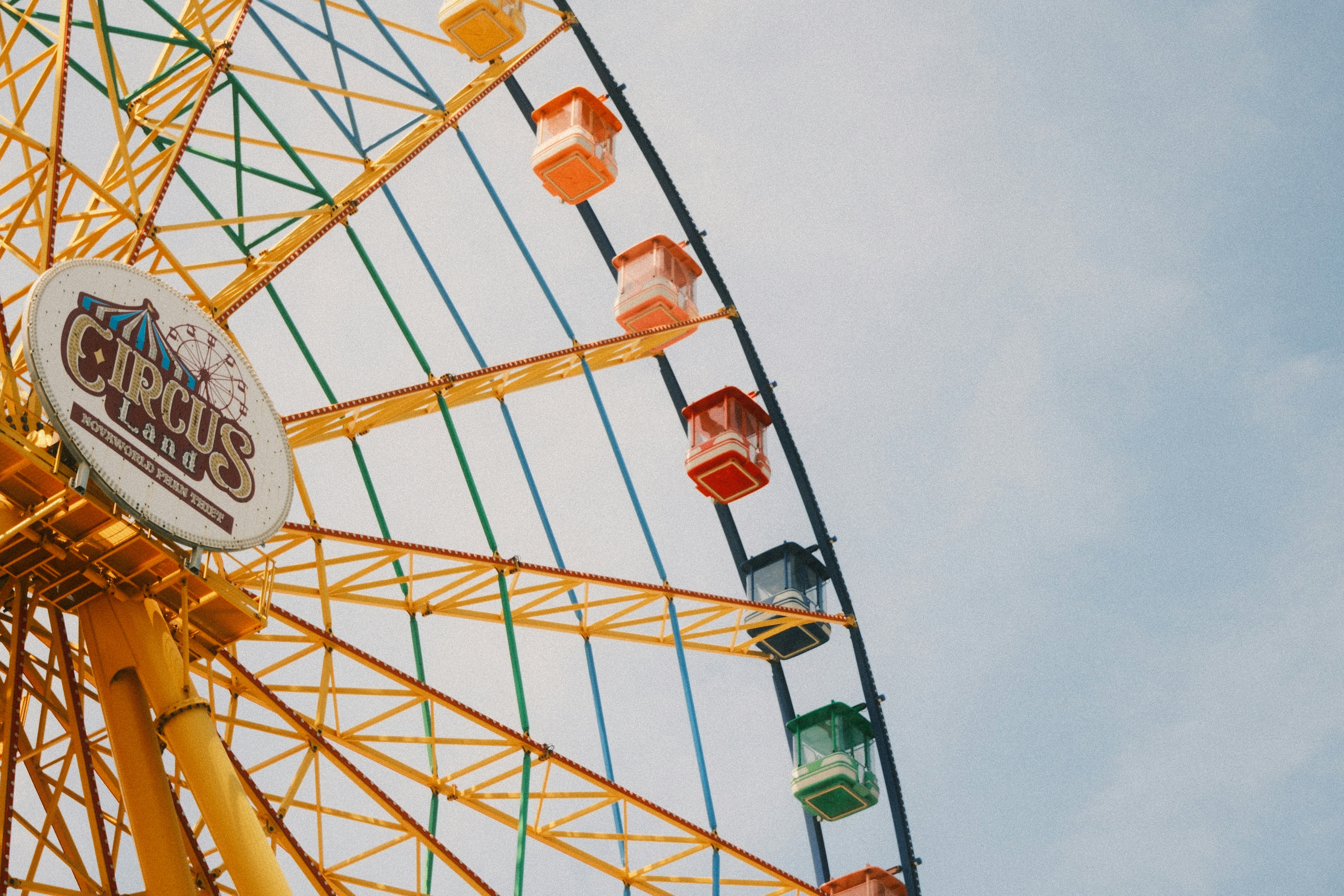 Colorful Ferris Wheel Aurora: A Midday Spin of Light