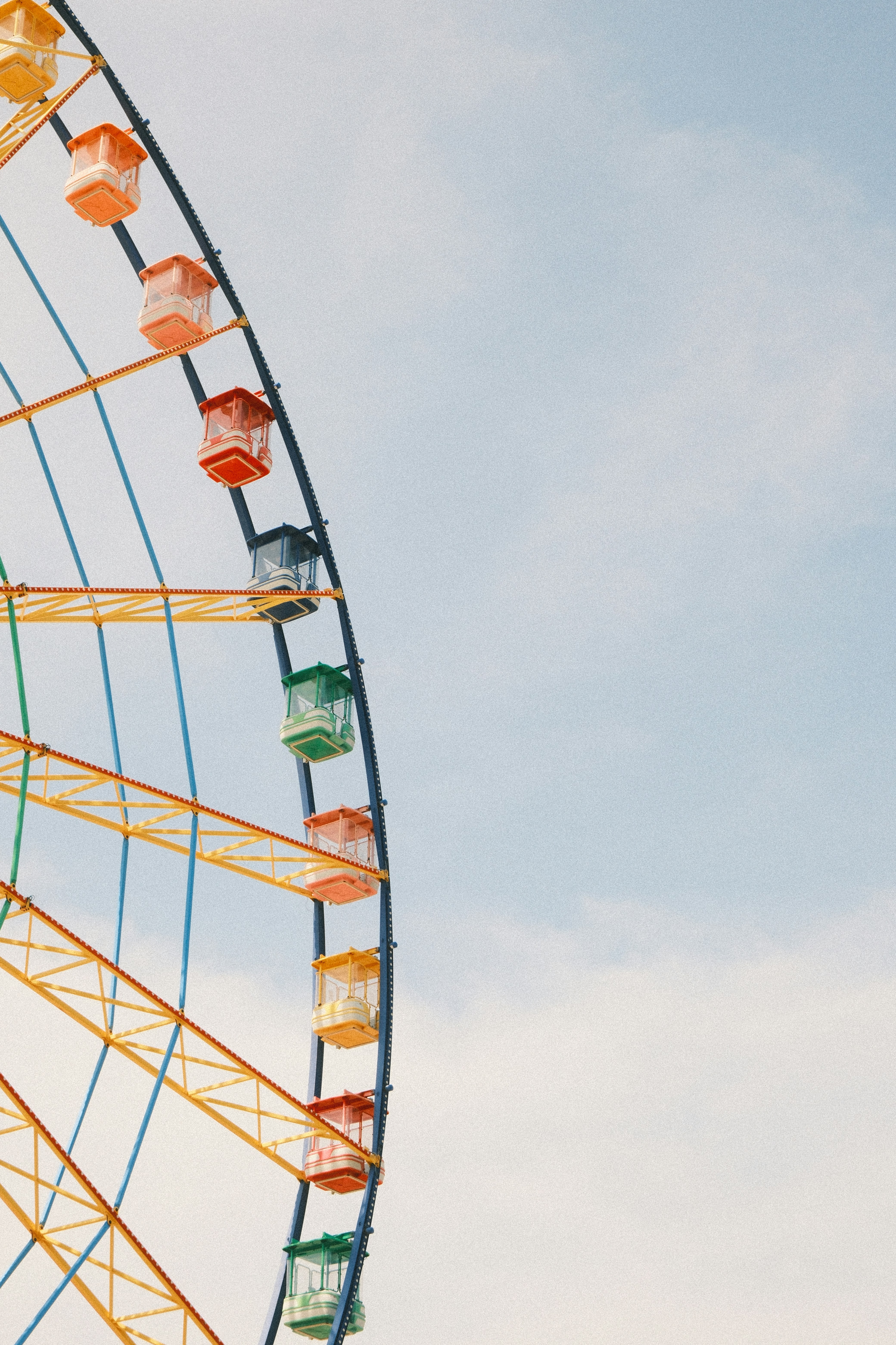 Colorful Ferris Wheel Edge: A Slice of Fairground Sky