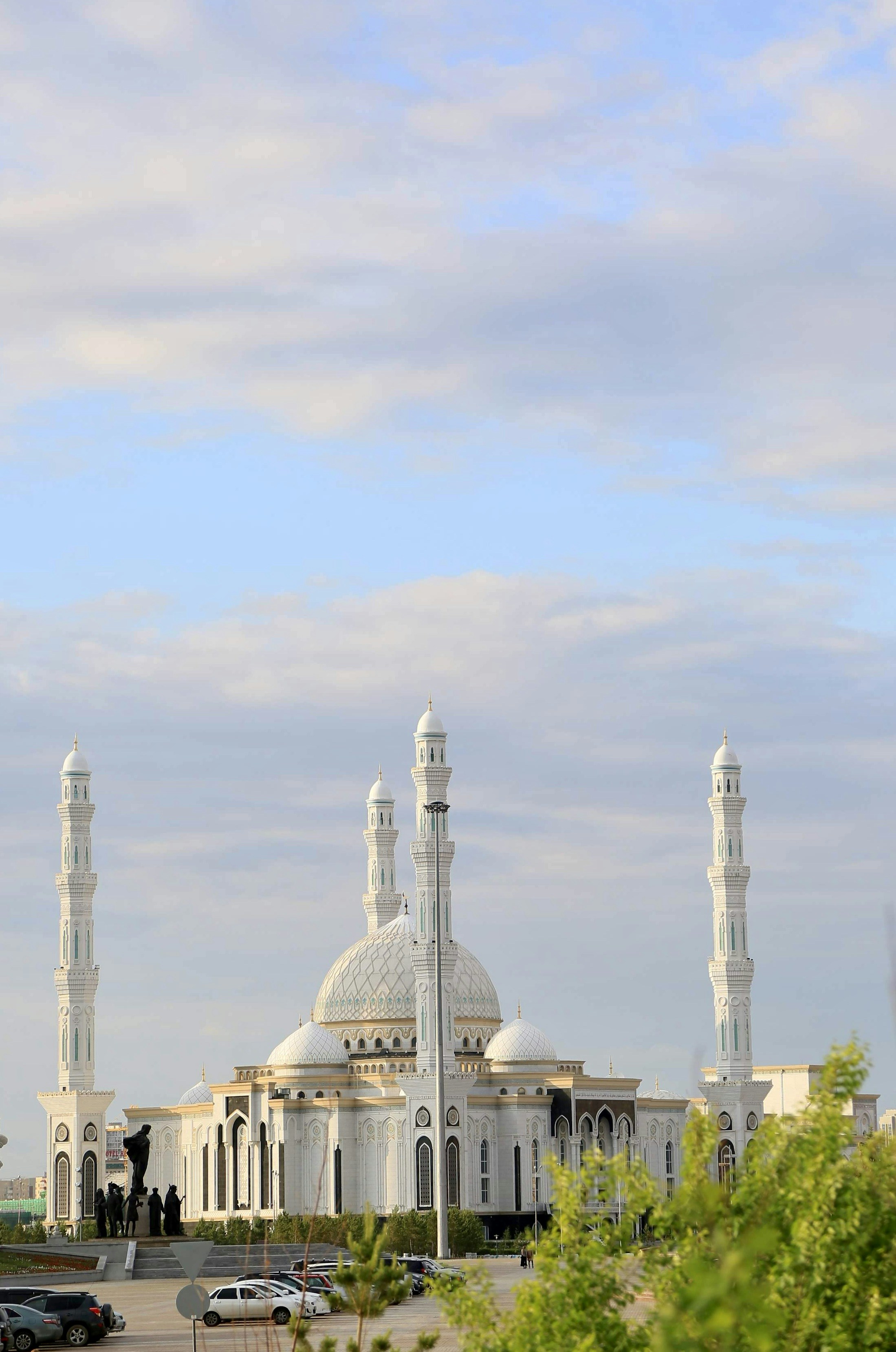 White Mosque Against a Soft Sky: Towers Piercing the Horizon