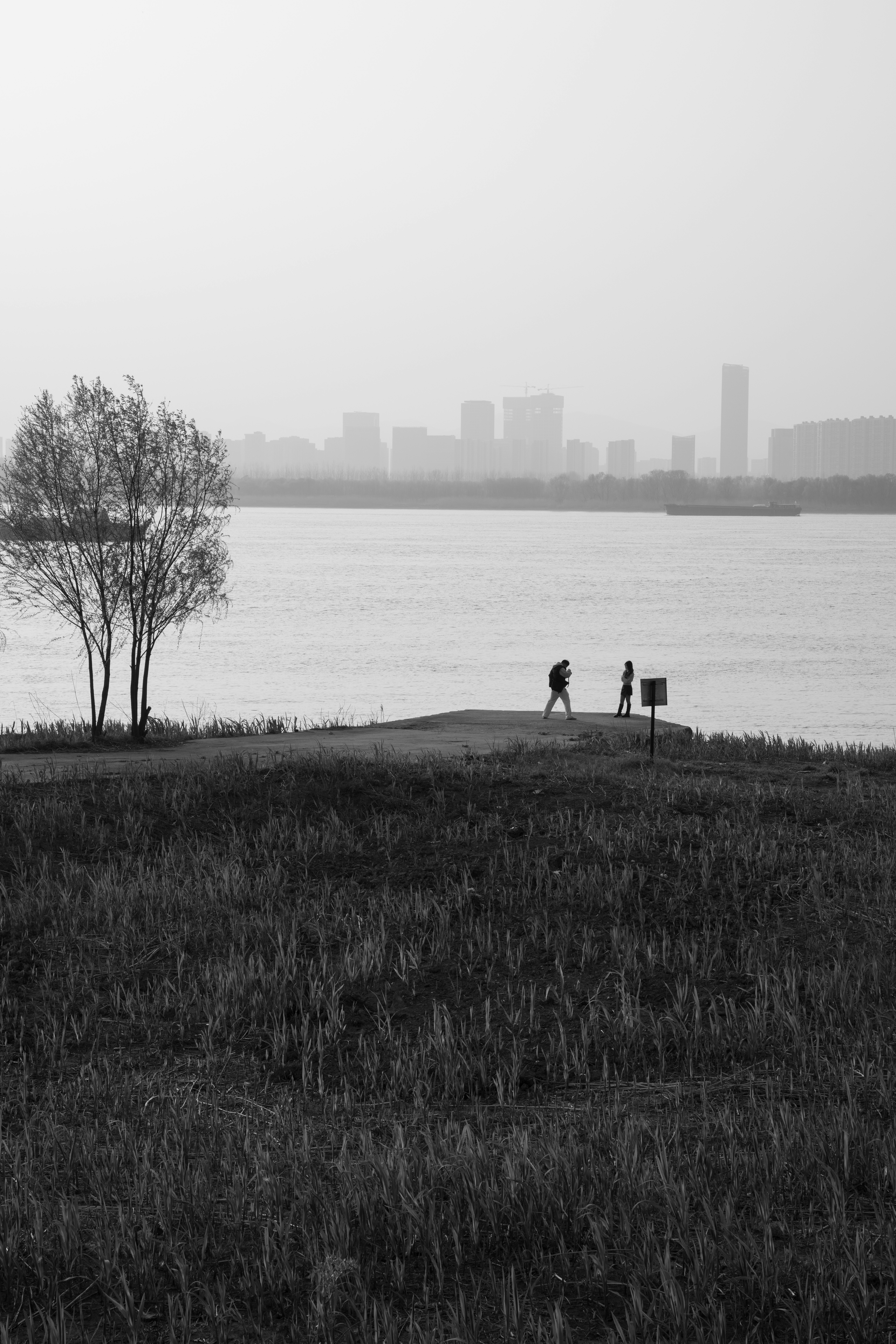 Pier at the Edge: Two Figures, Quiet Horizon