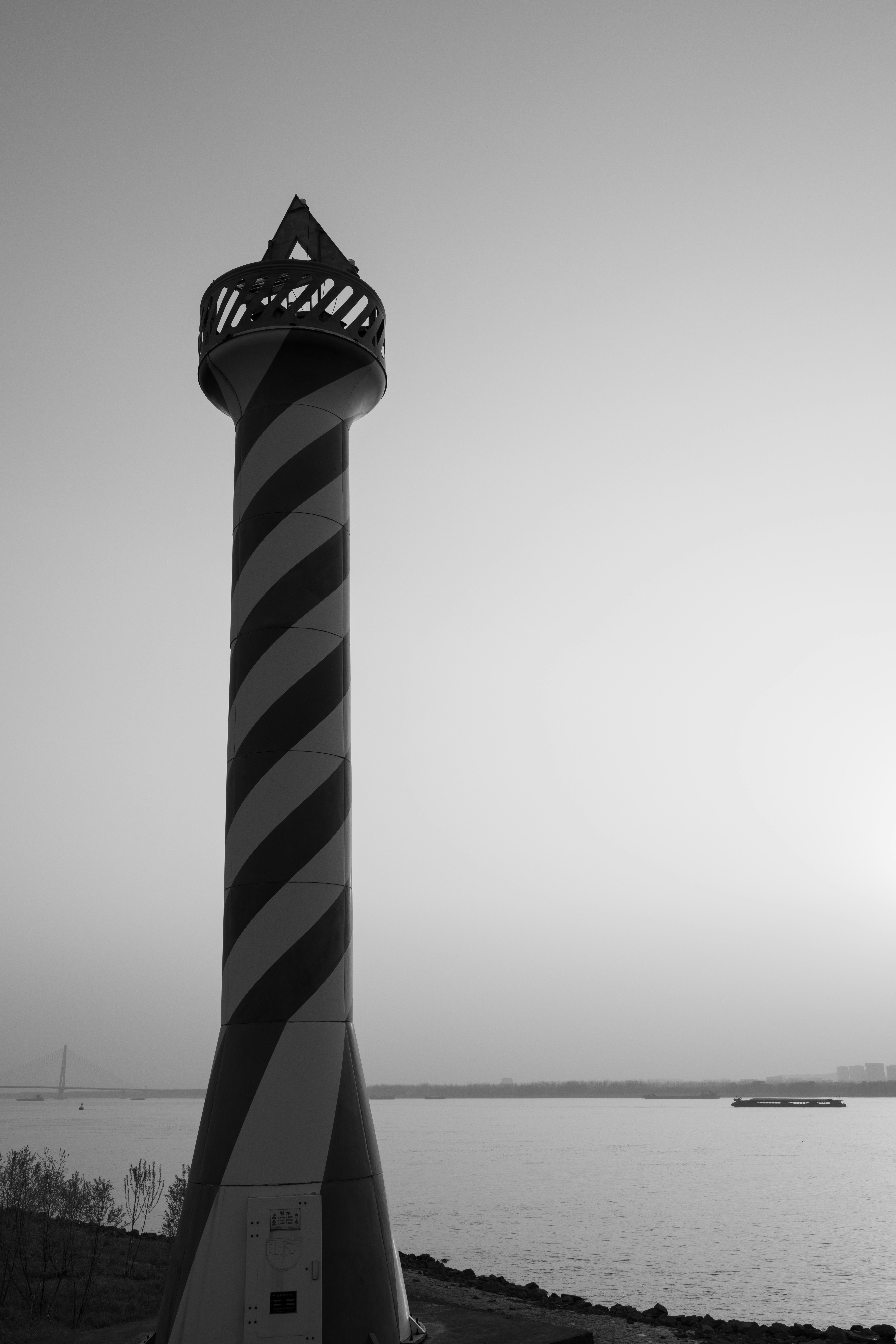 Lighthouse Spiral: A Quiet Sentinel Over Still Water