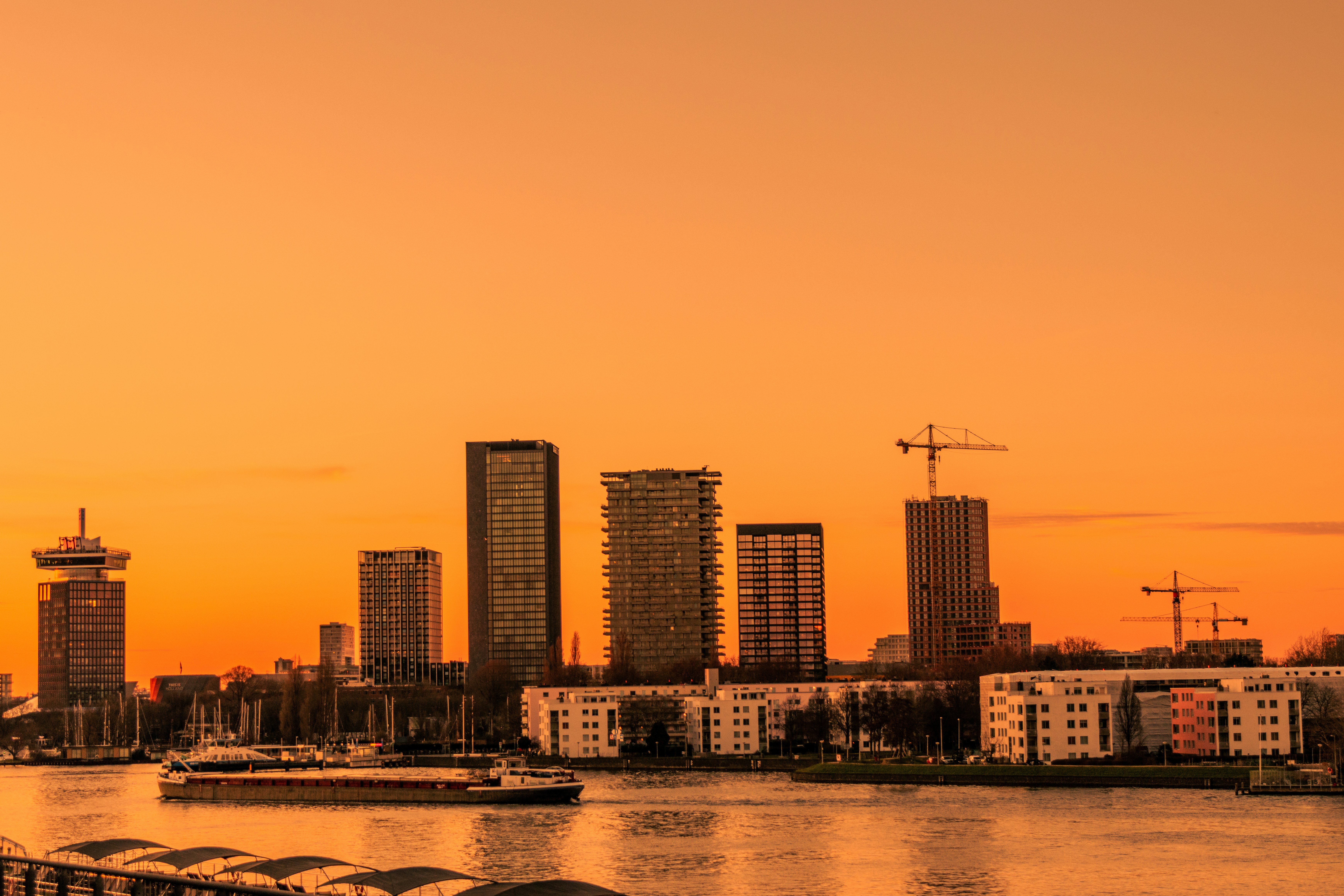 Golden Hour Axis: skyline bathed in amber over calm river