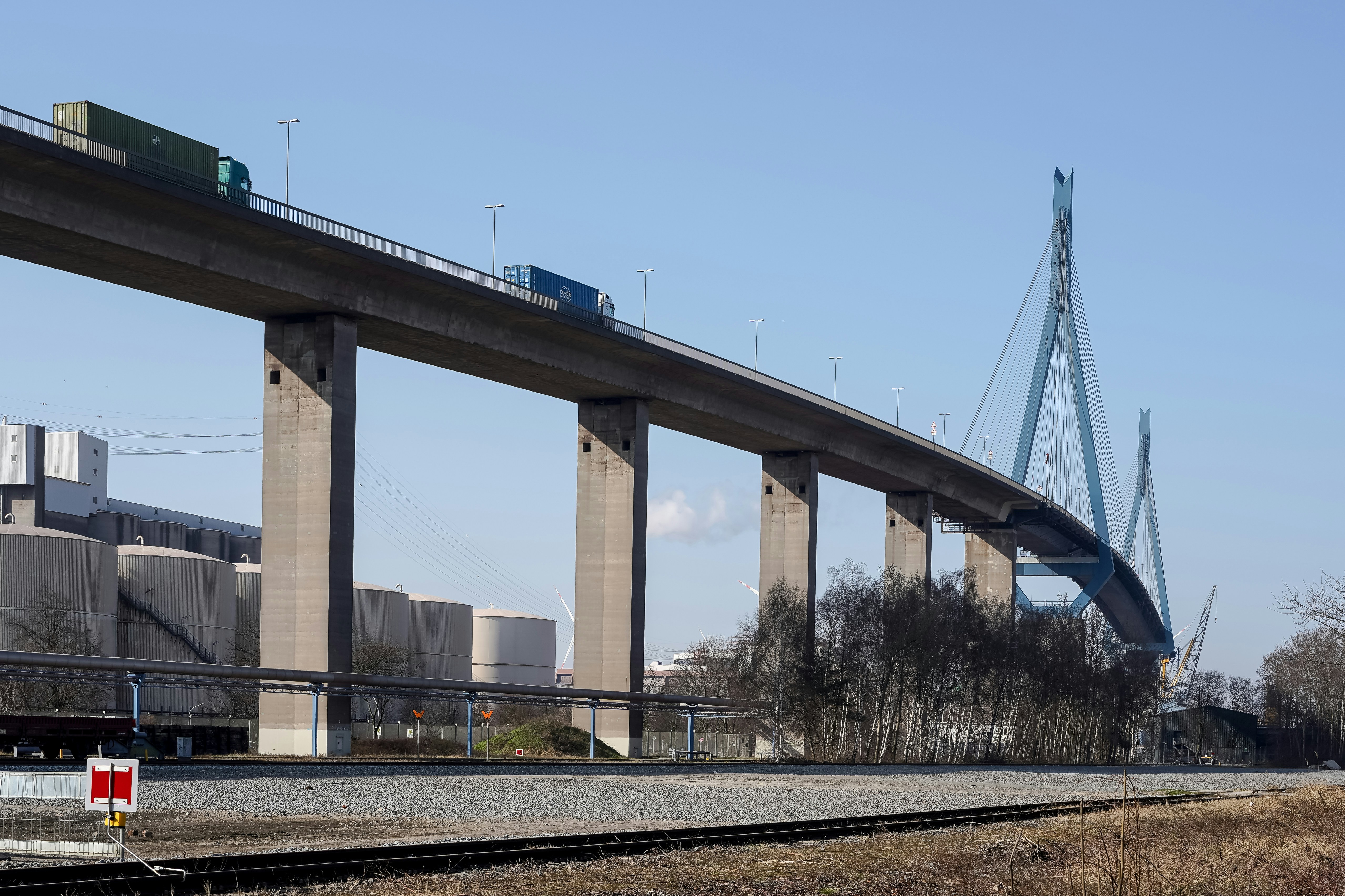 Bridge Over Broad Descent: A Freight-Train and a Cable-Supported Span