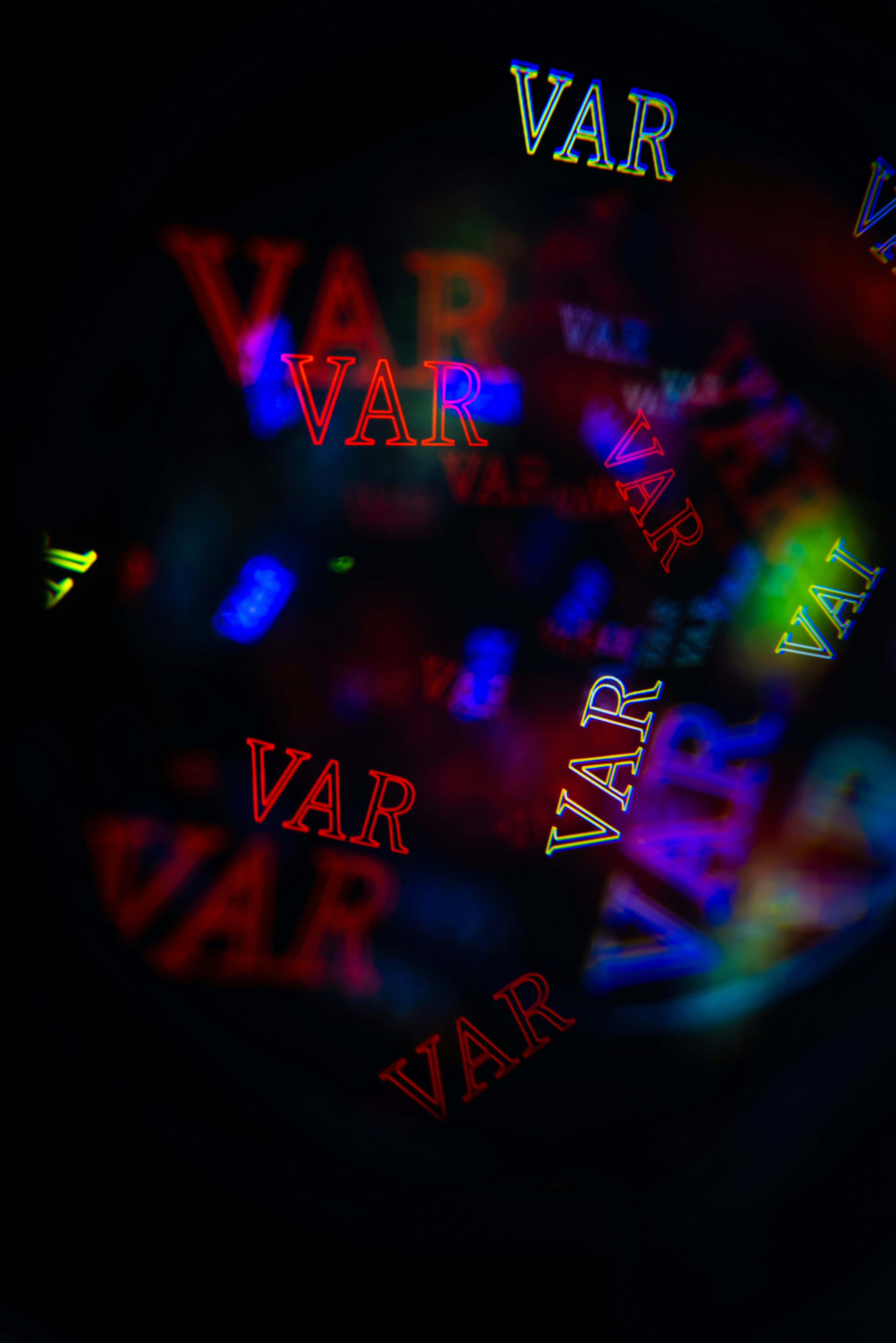MULTI-COLOR VAR Letters: a kaleidoscopic bokeh of branding across darkness
