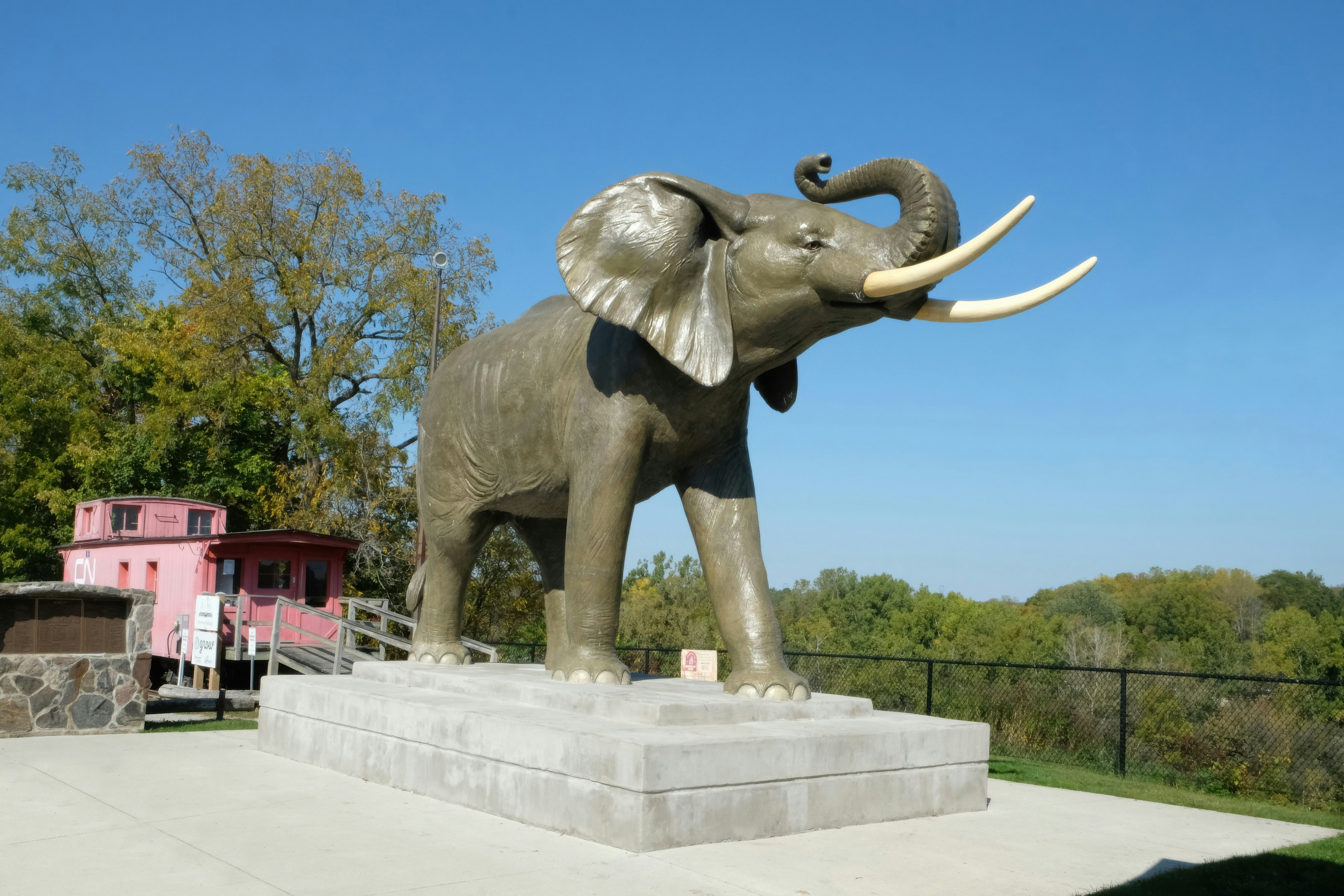 Triumphant Elephant Bronze: A Mighty Sentinel on a Stone Plinth