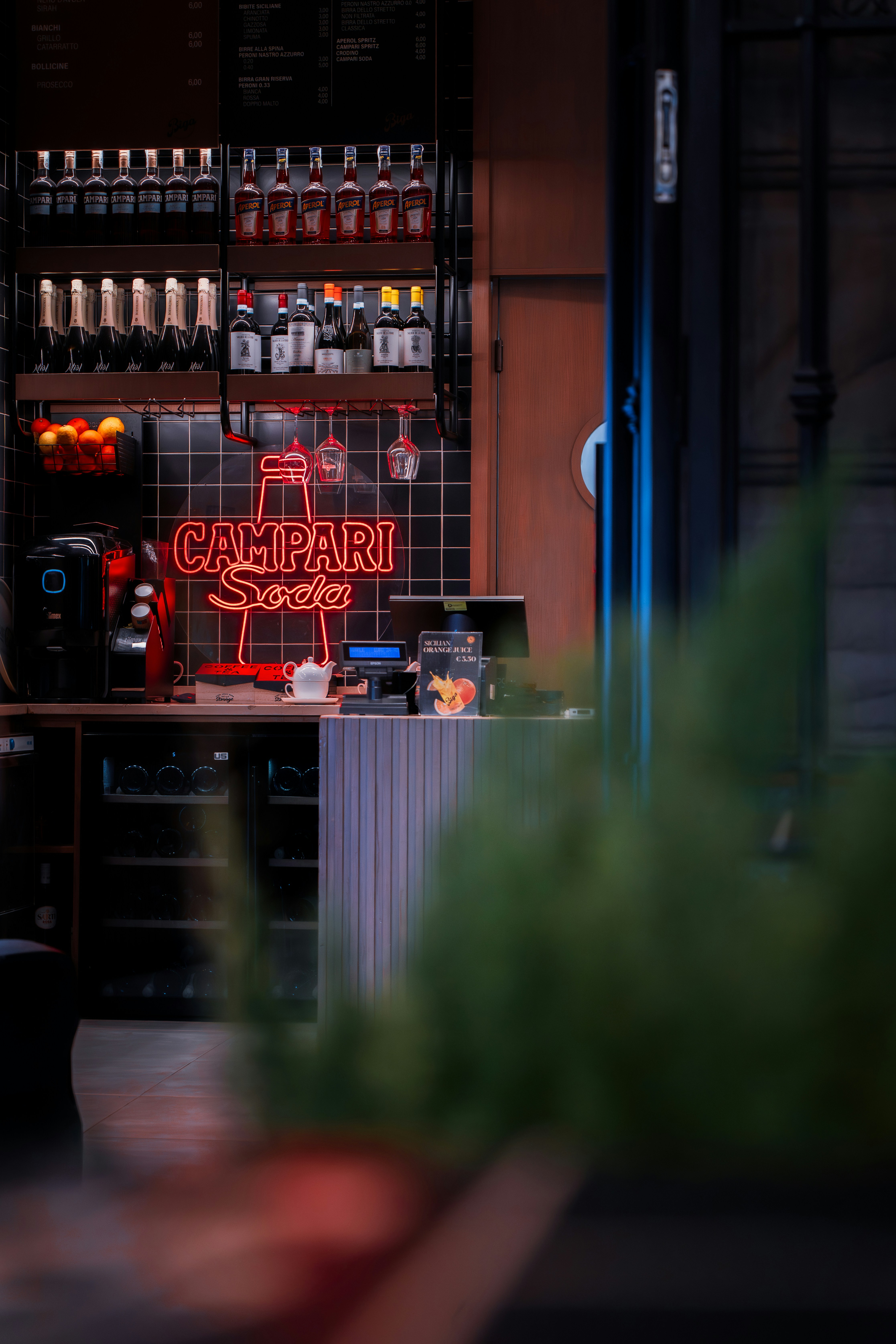 Neon Campari Sign Illuminates a Luxe Bar Nook