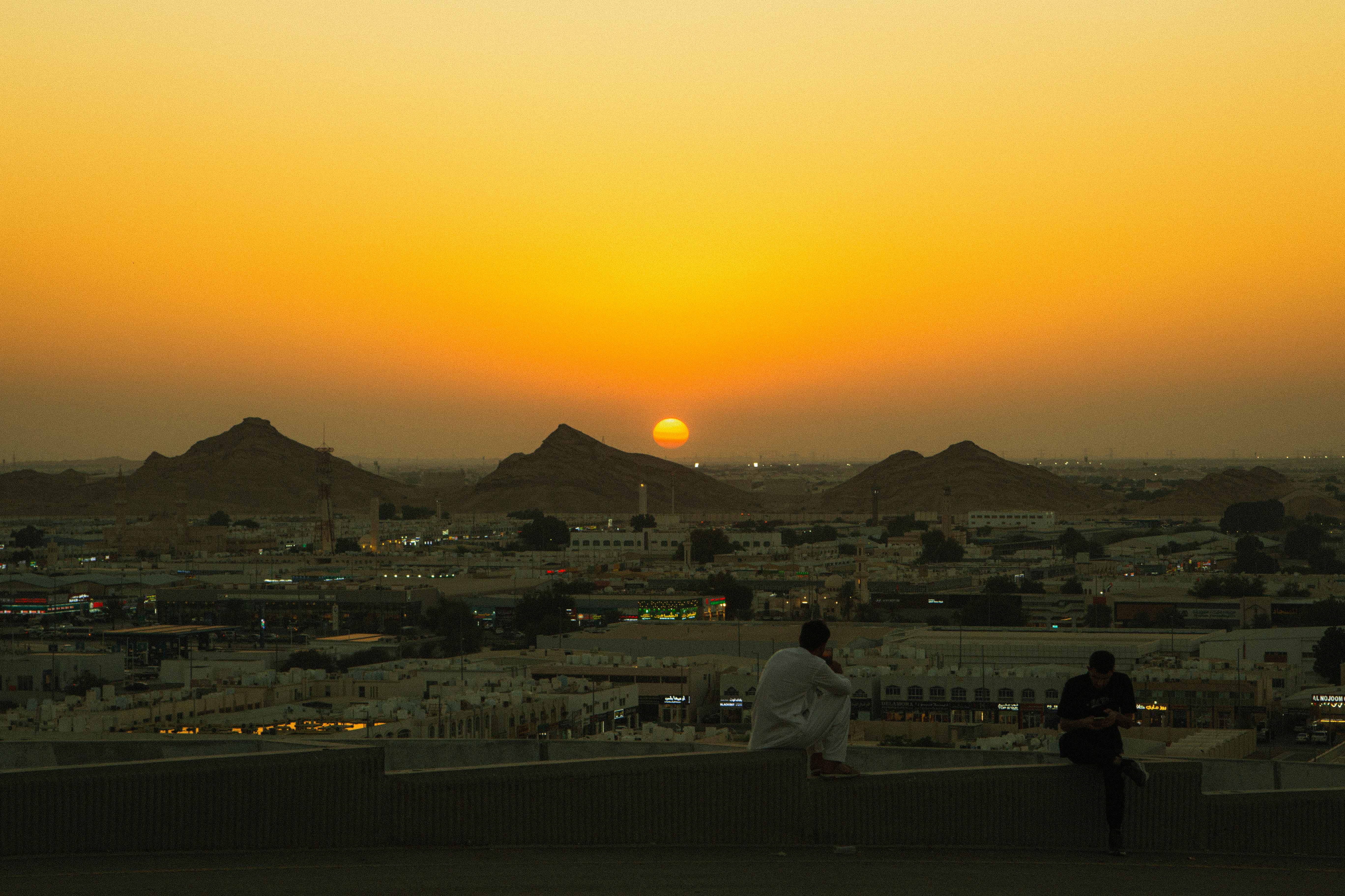 Sunset Over the Distant Ridge: Quiet Figures on the Terrace