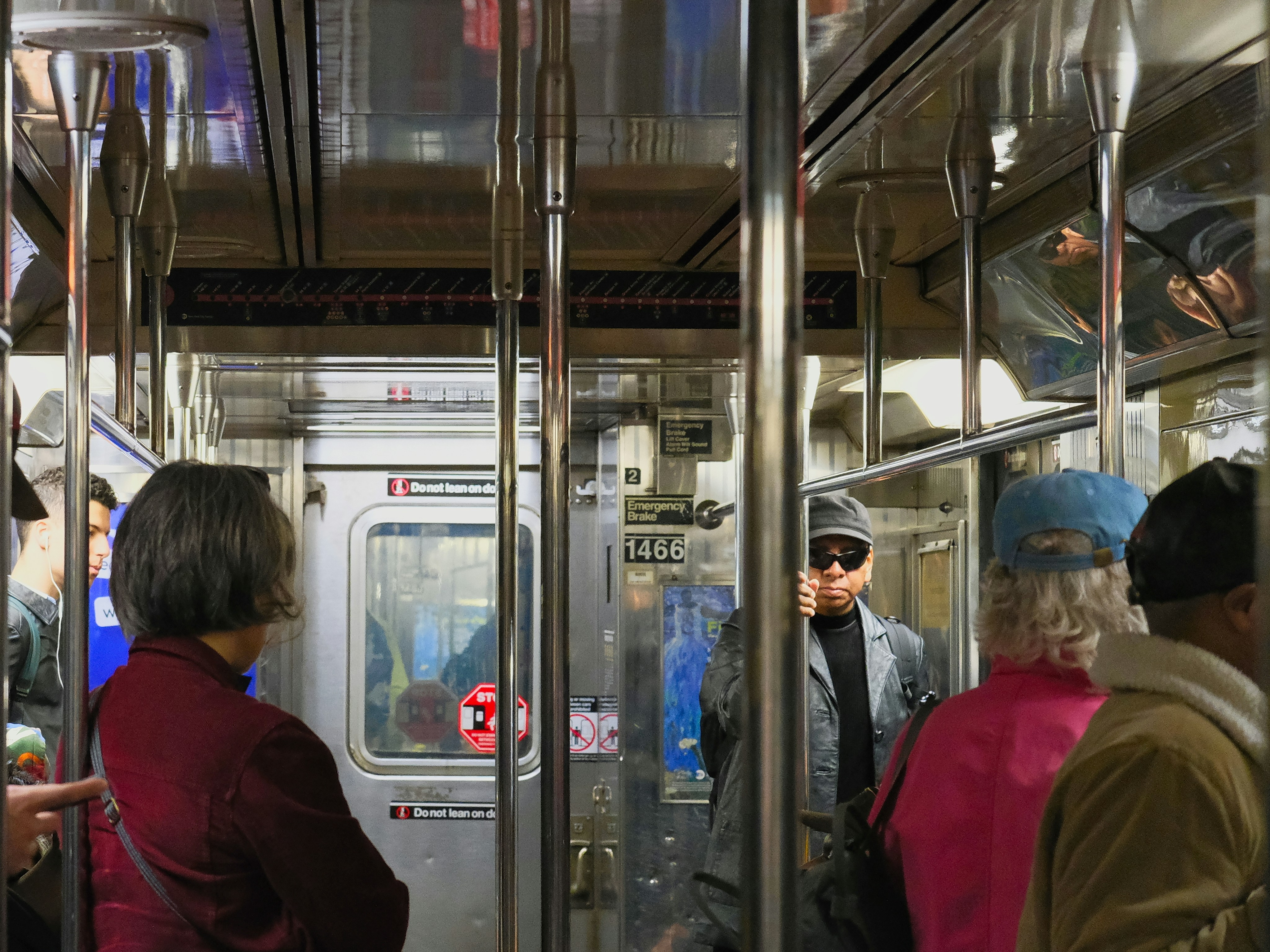 Subway Car Portrait: Quiet Moment Amid Movement