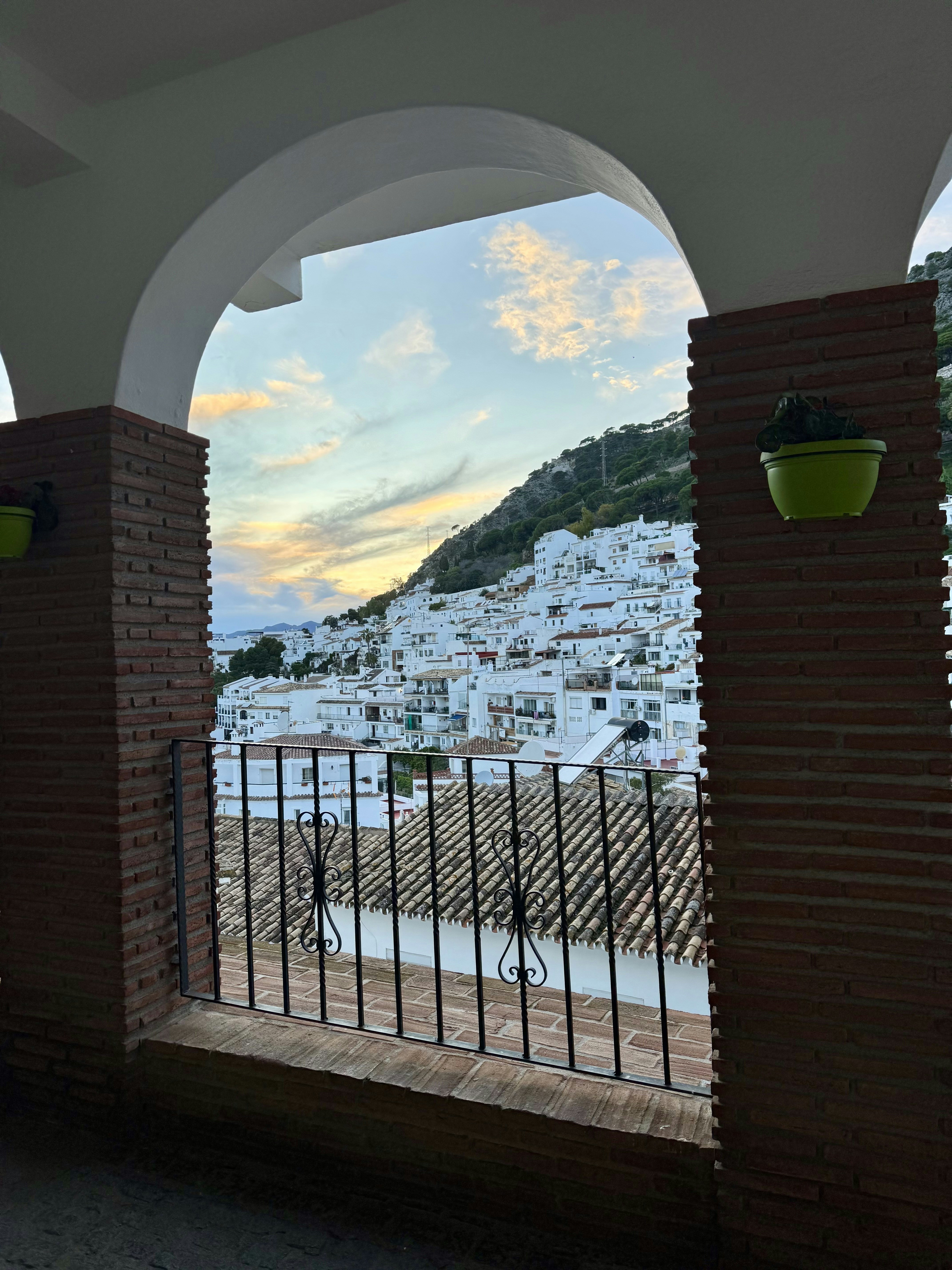Blue-Tiled Village Vista from a Covered Balcony