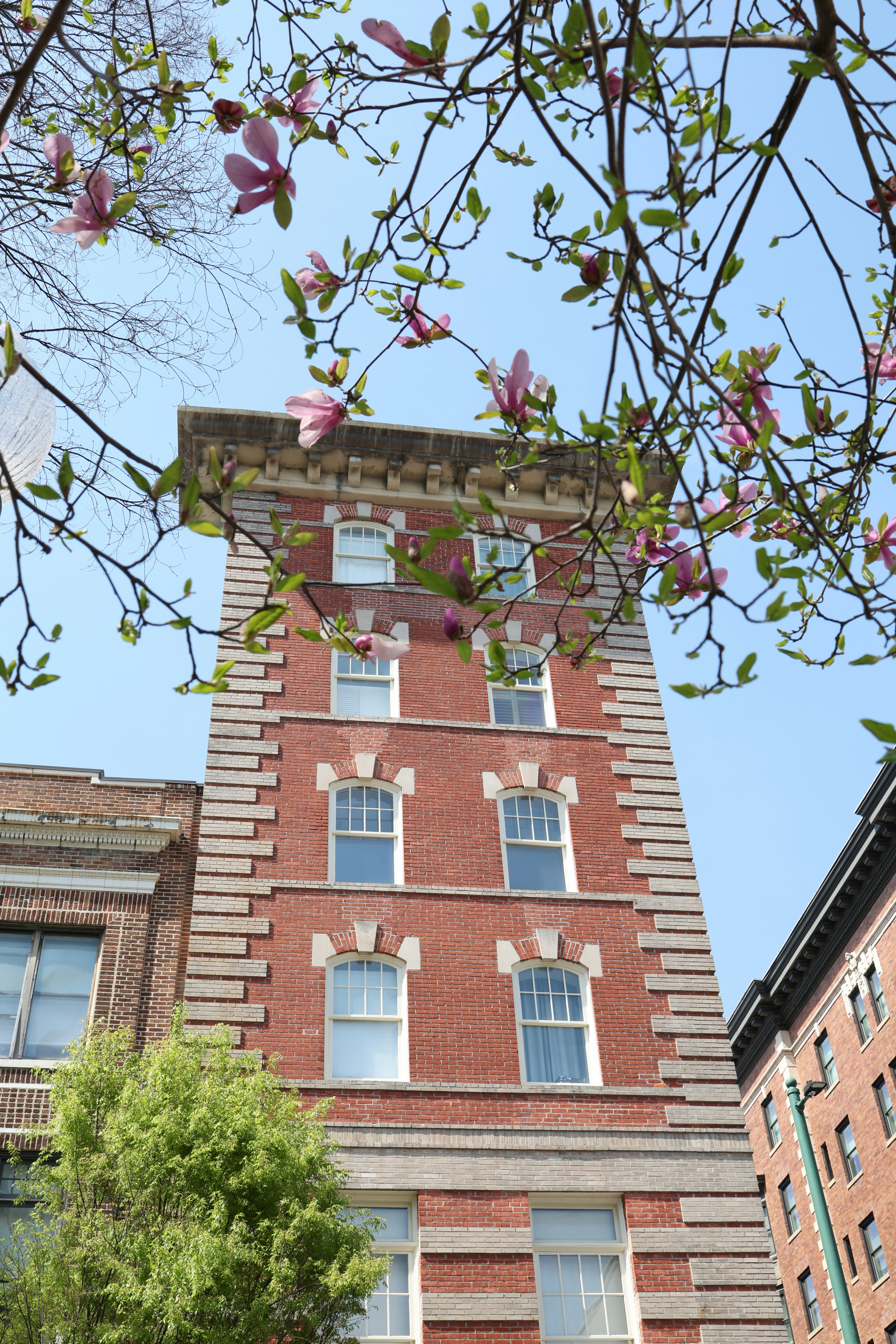 Brick Tower Reaching Toward a Clear Sky