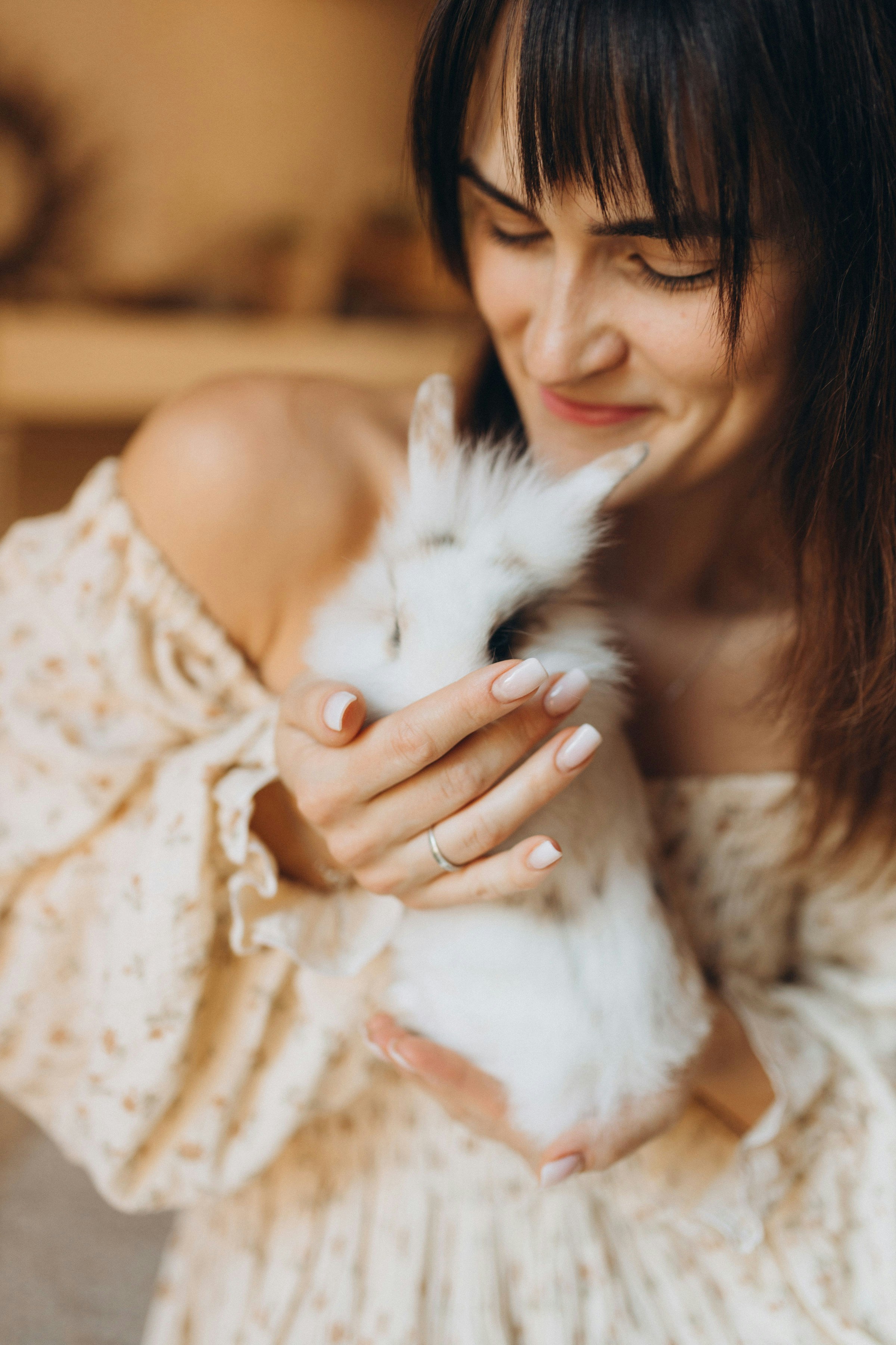 Soft Bond: A Quiet Moment Between Woman and White Kitten
