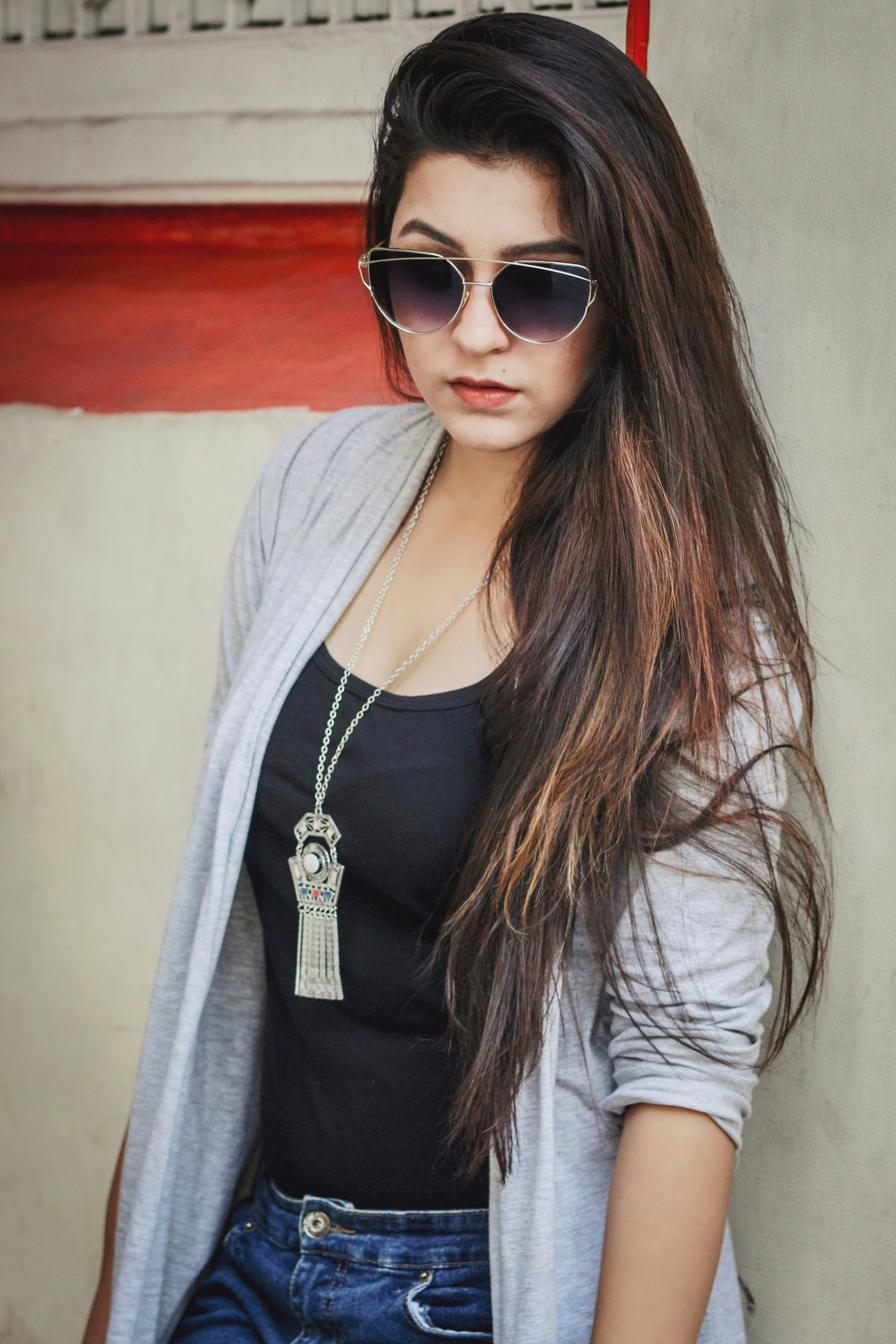 Urban Edge: Sunglasses, Long Locks, and a Quiet Confidence
