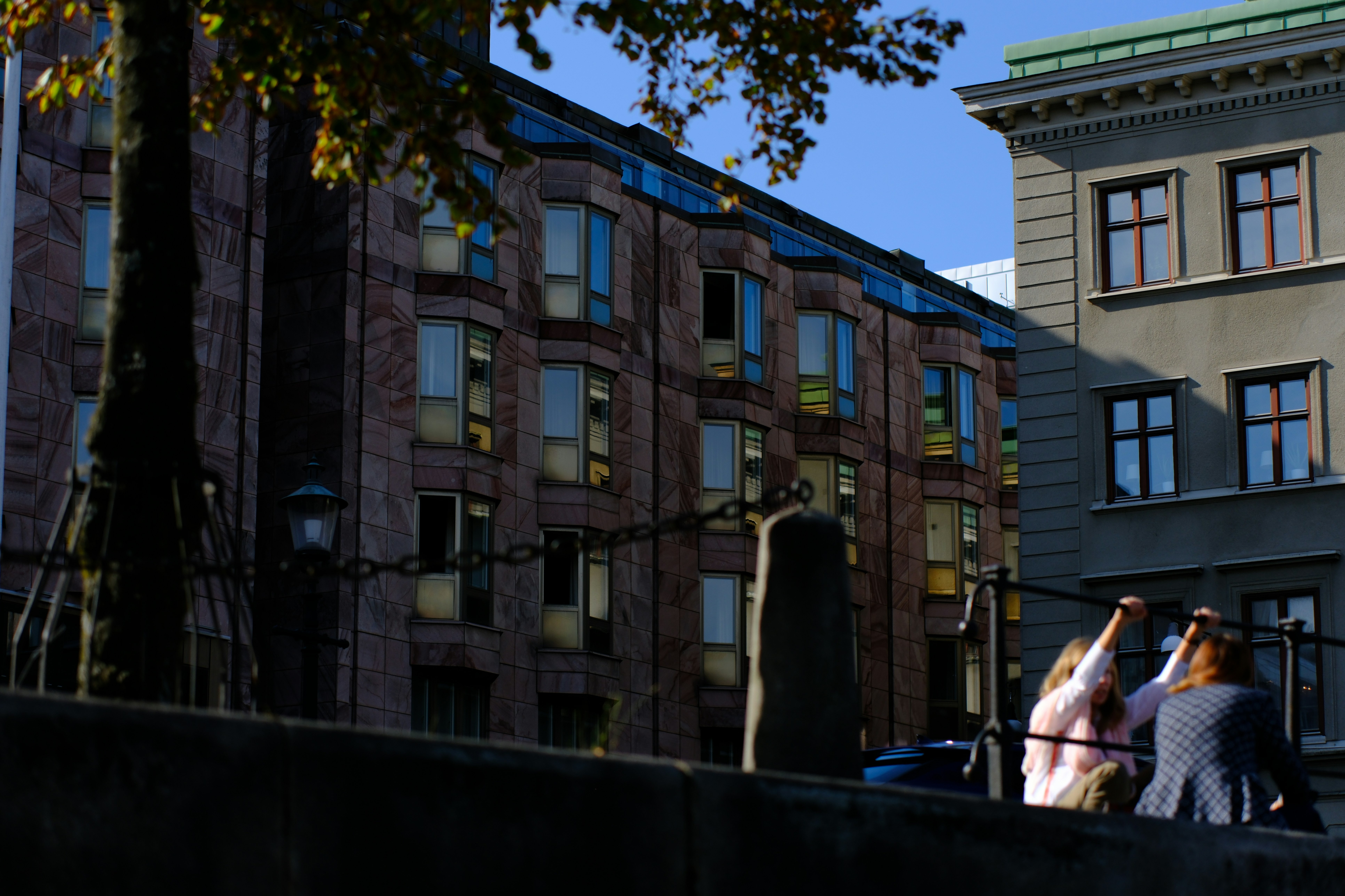City Light and Shadow: People in the Edge of the Frame