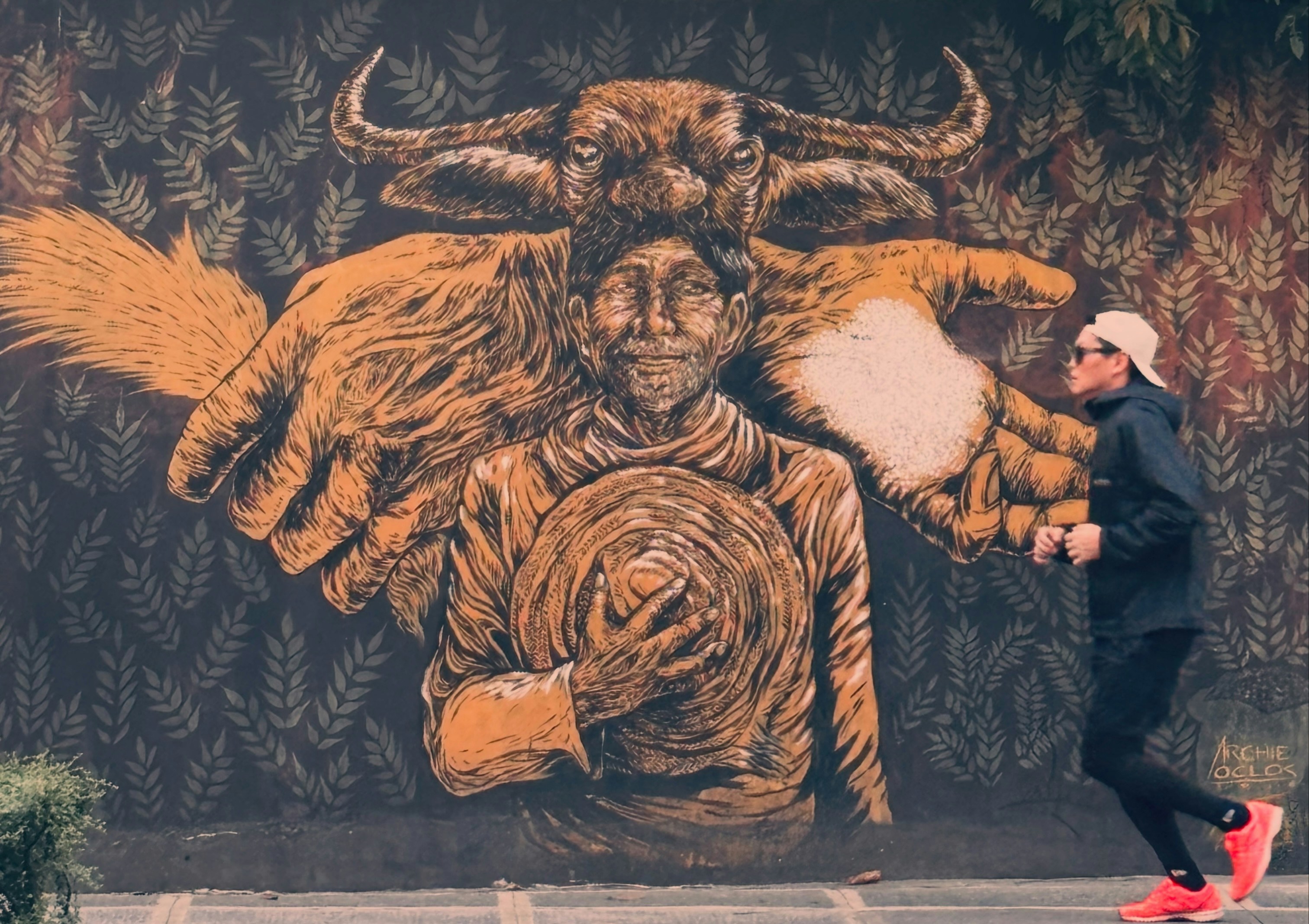 Giant Horned Portrait and Runner: Street Art with a Moving Frame