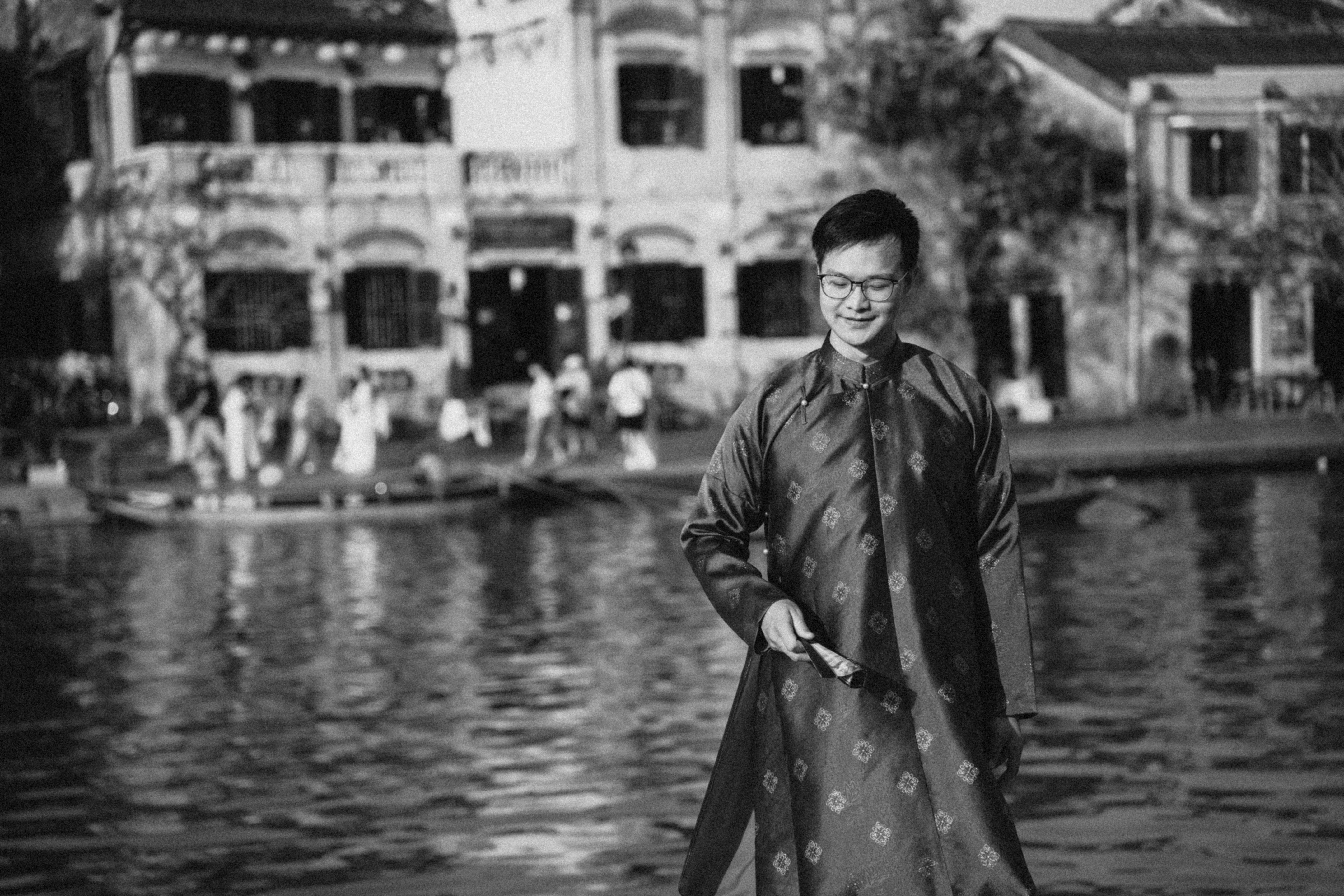 Floating Confidence: A Man in Traditional Attire by the Water