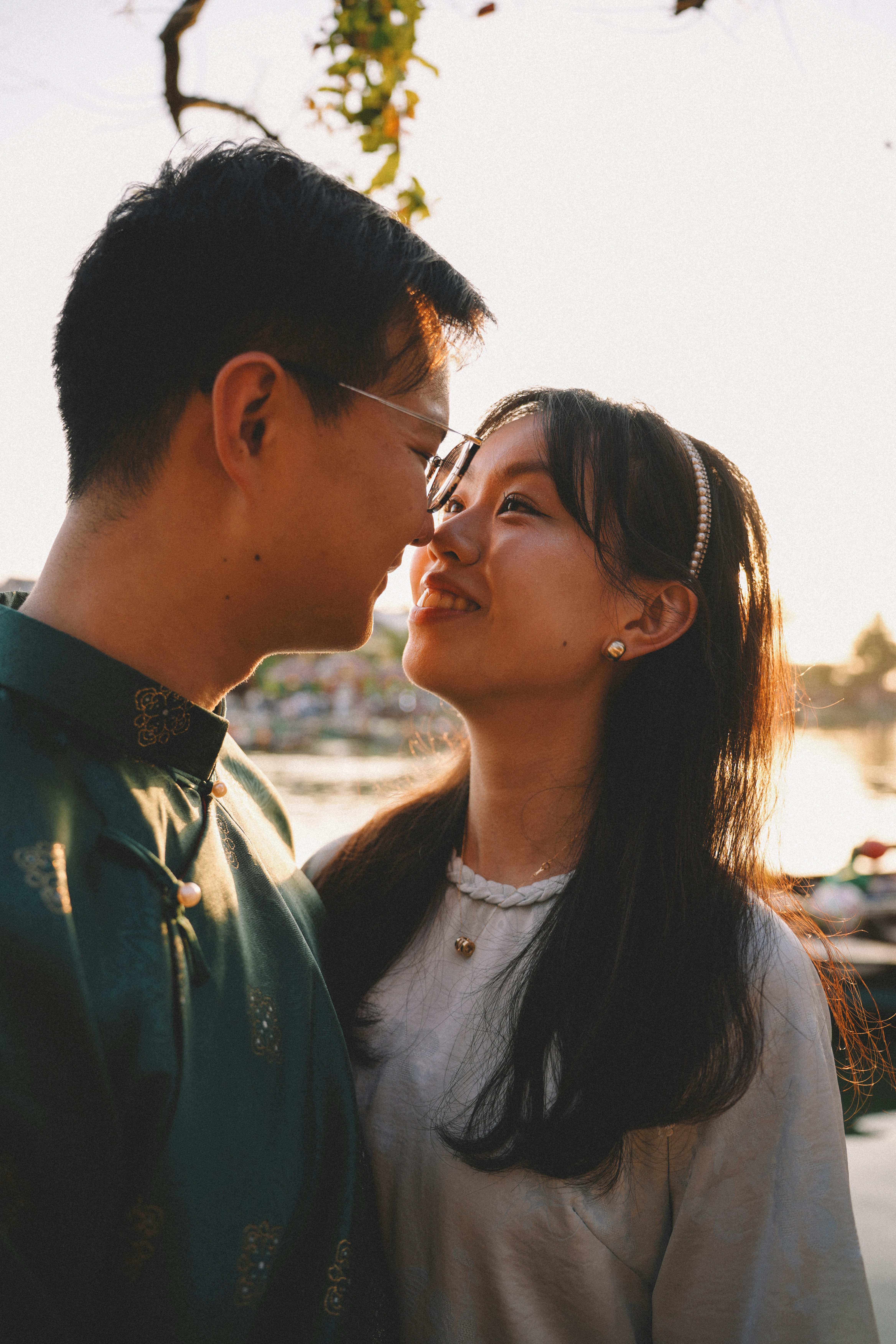 Close-Quarters Glow: Two Faces Lean in at Sunset