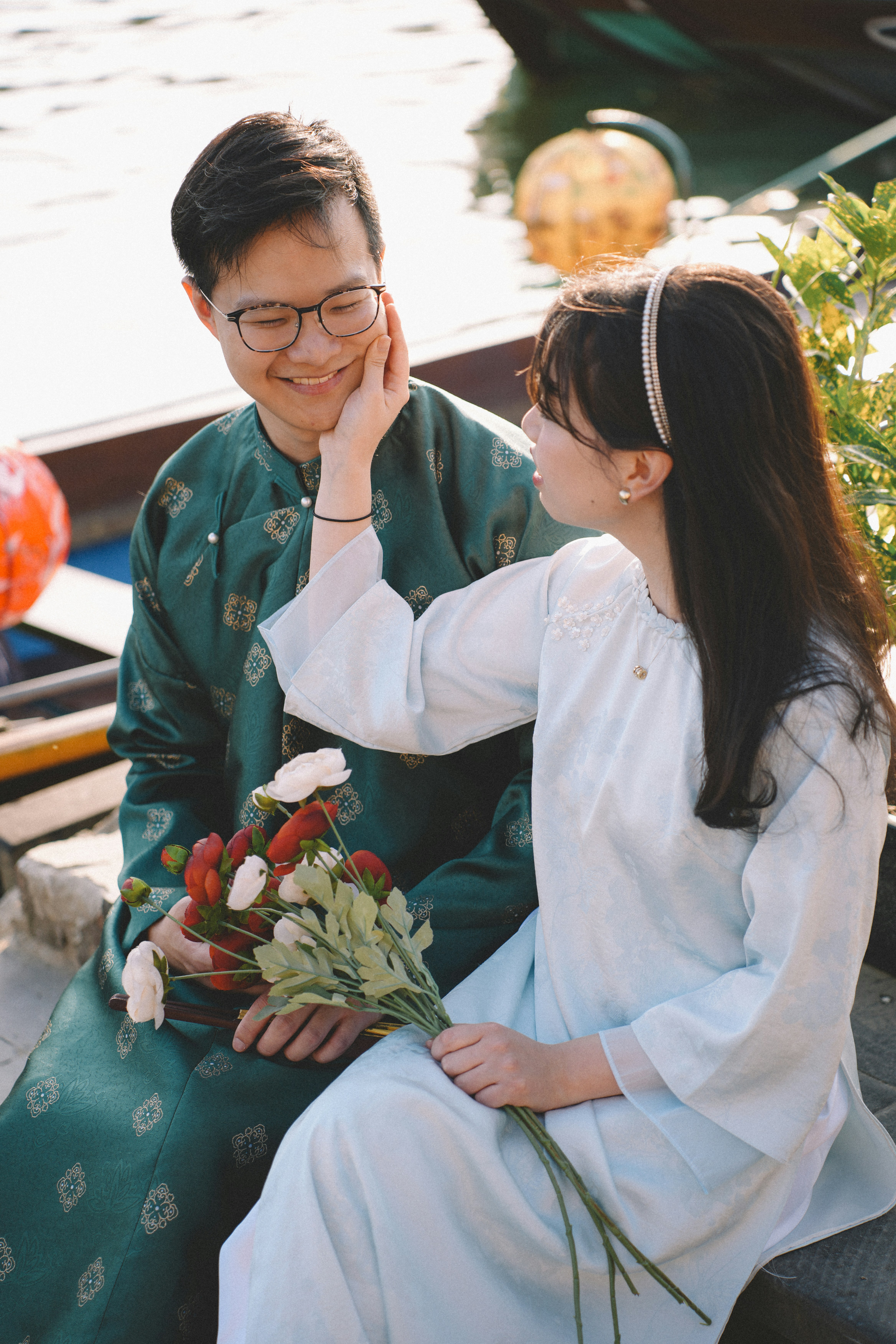 Tender Exchange: A Quiet Moment Between Partners in Traditional Attire