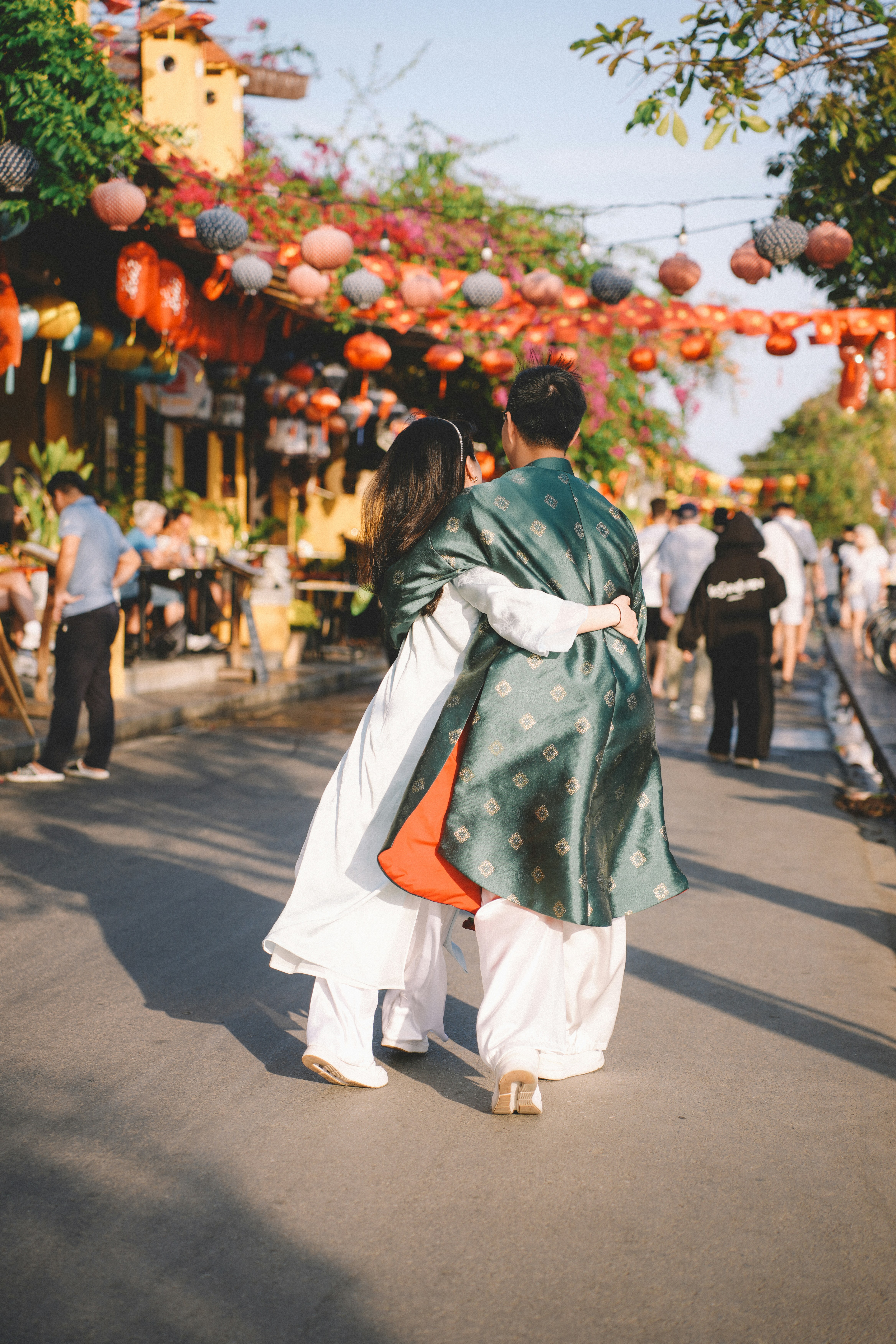 Embrace Under Lanterns: A Quiet Hug Through the Festival Lane