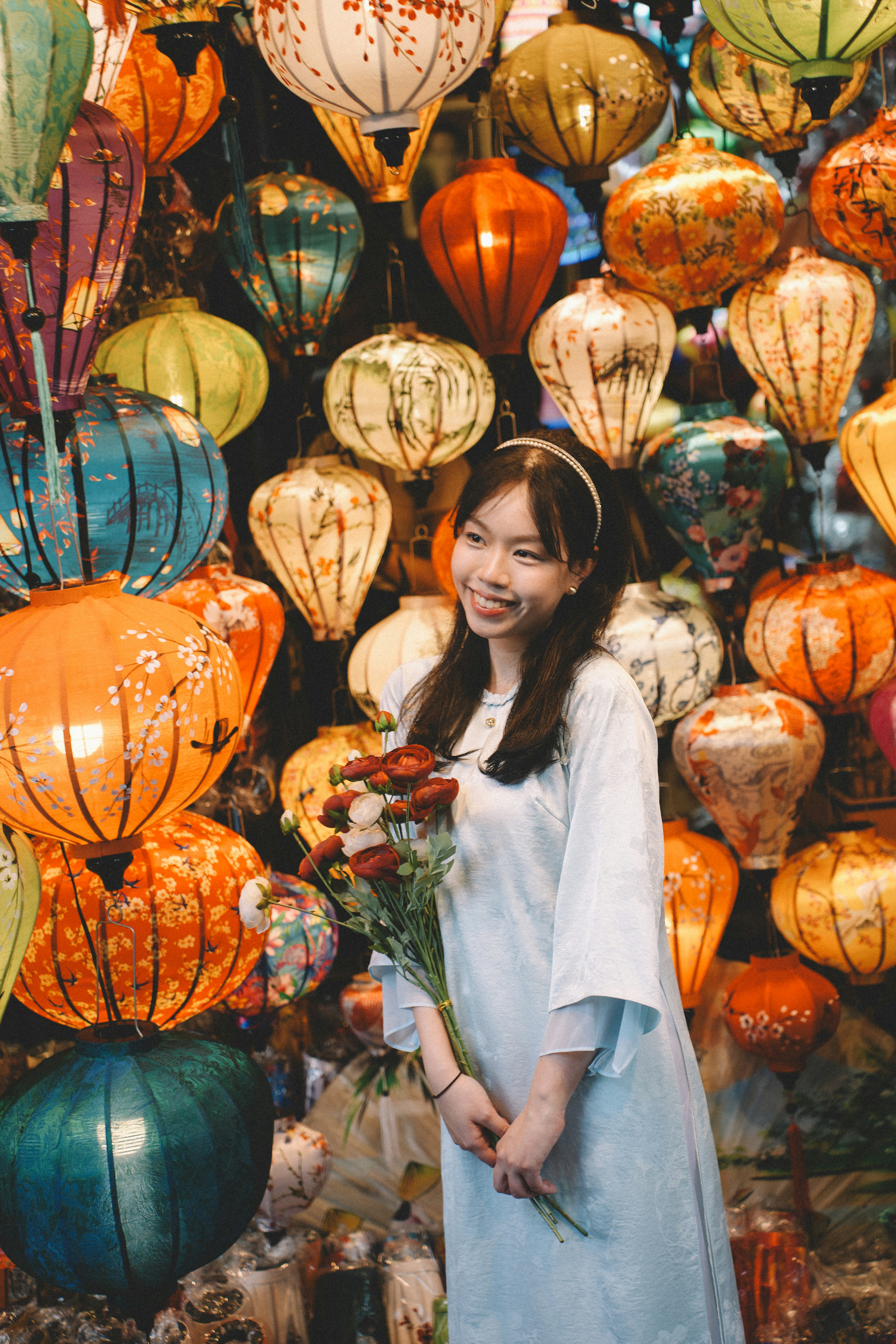 Floral Lantern Portrait: A Soft Smile Amid Lanterns