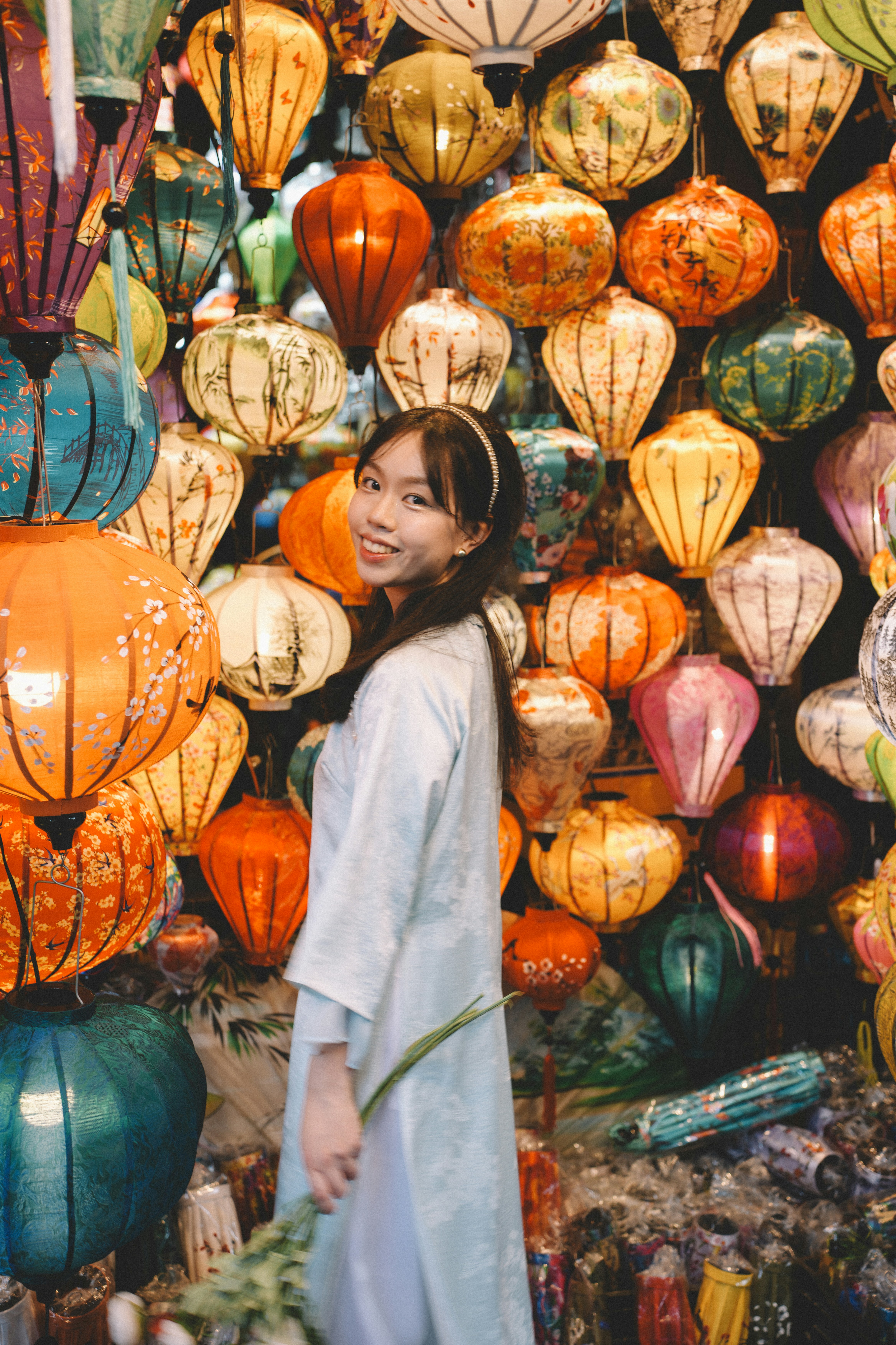 Lanterns and Laughter: Portrait Amid a Sea of Orbs