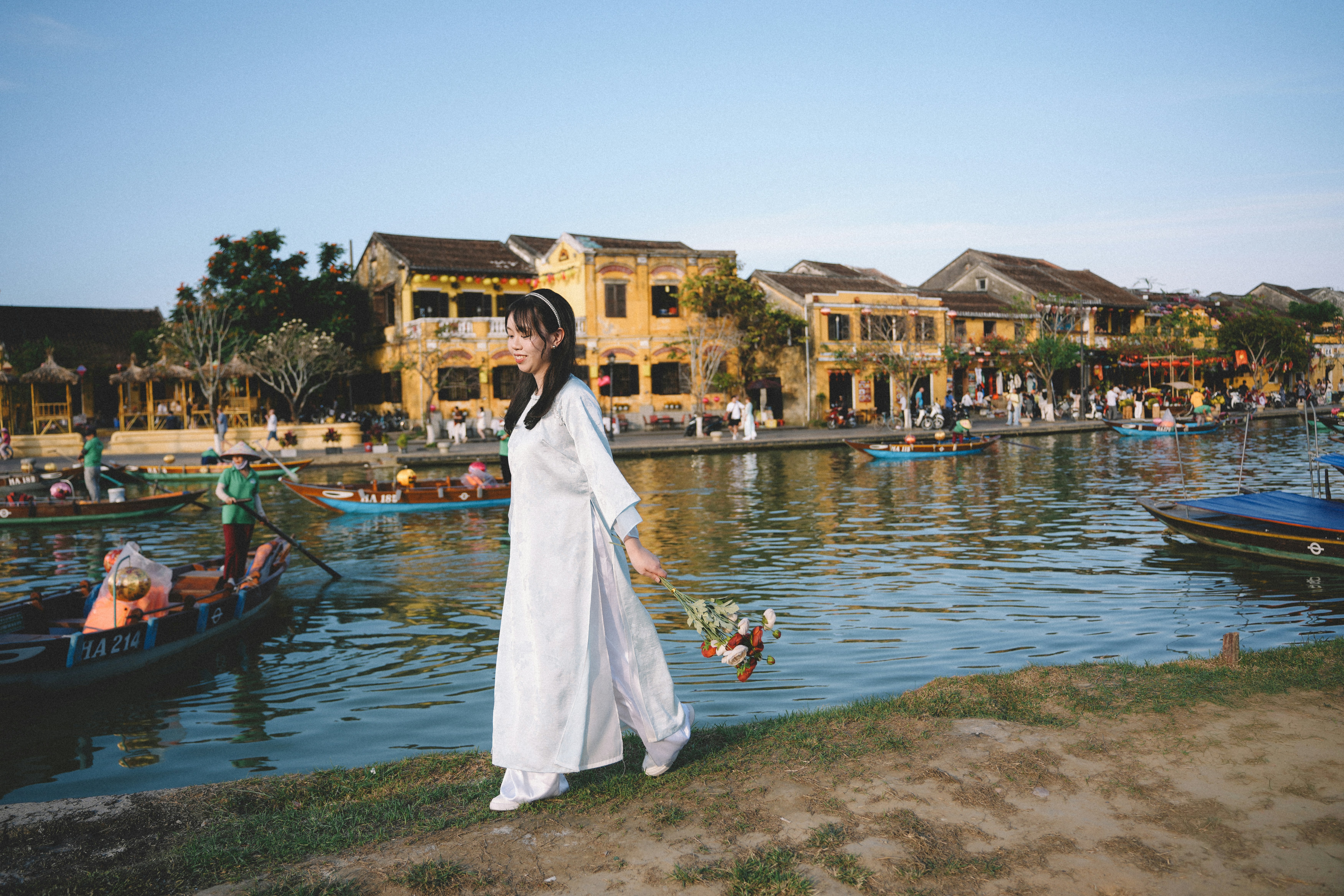 White-gown wanderer by the floating village
