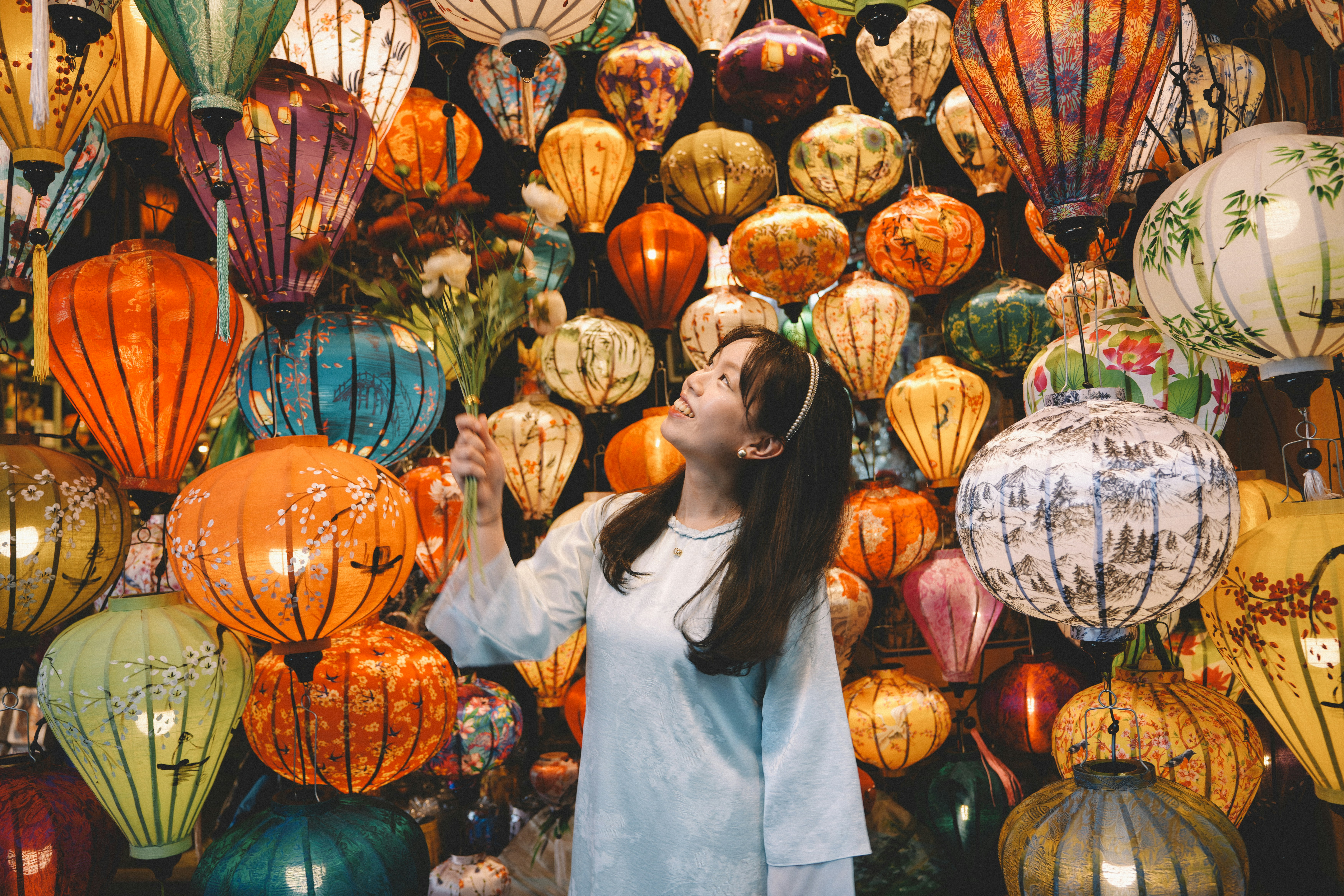 Girl in a Sea of Lanterns: A Moment of Wonder