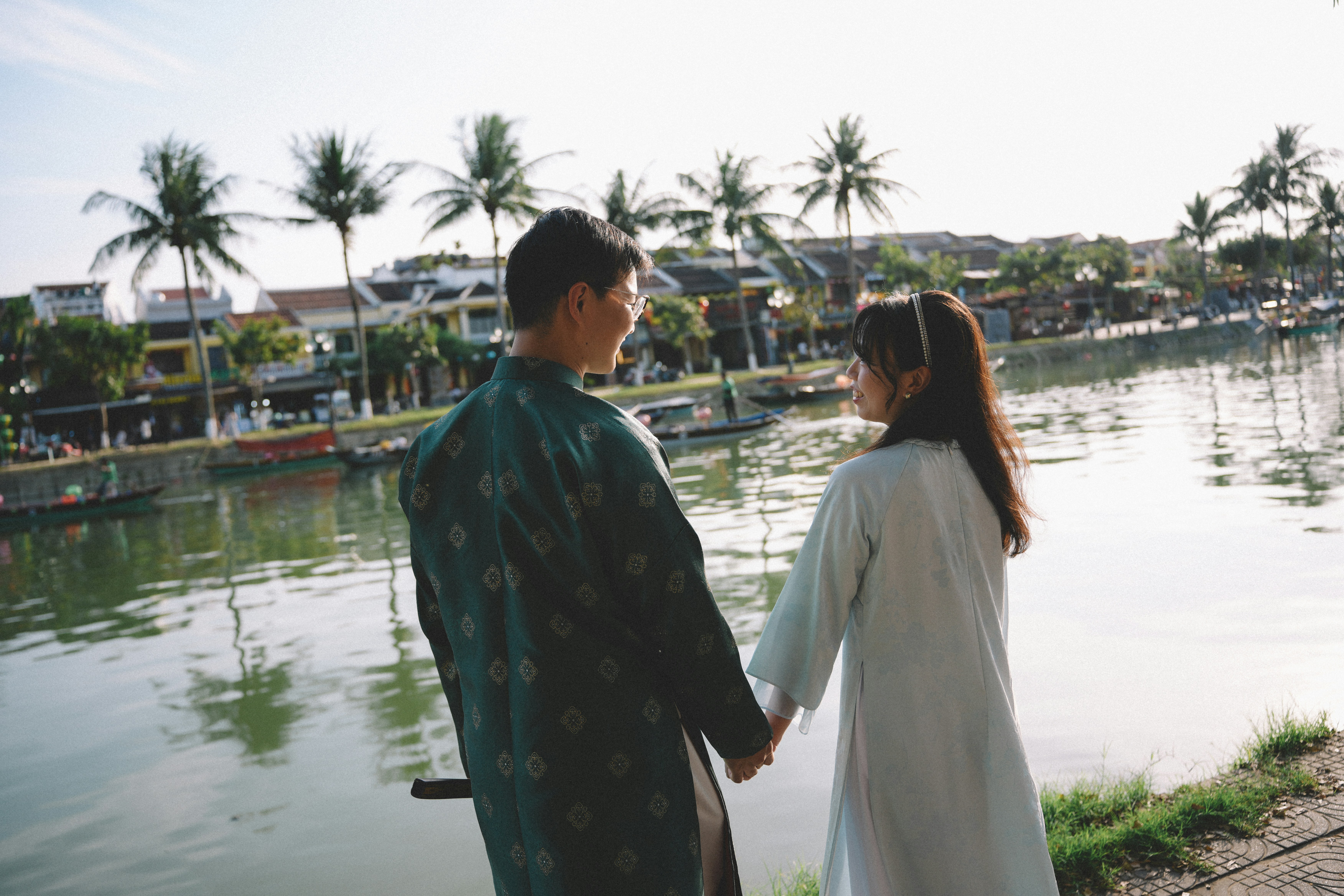 Holding Hands by the Waterfront: A Quiet Moment Between Two Lovers