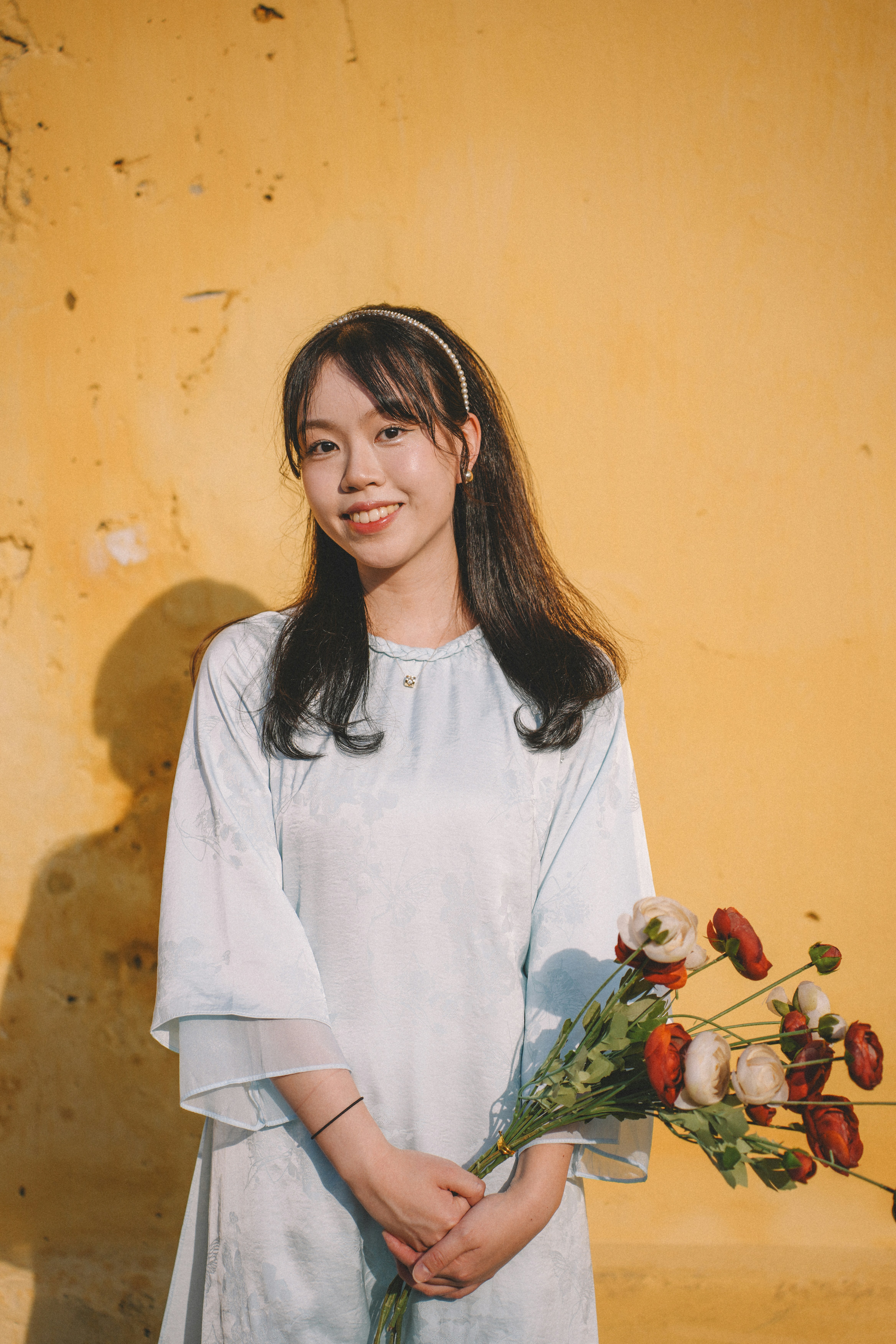 Sunlit Portrait in a Summer-yellow Wall